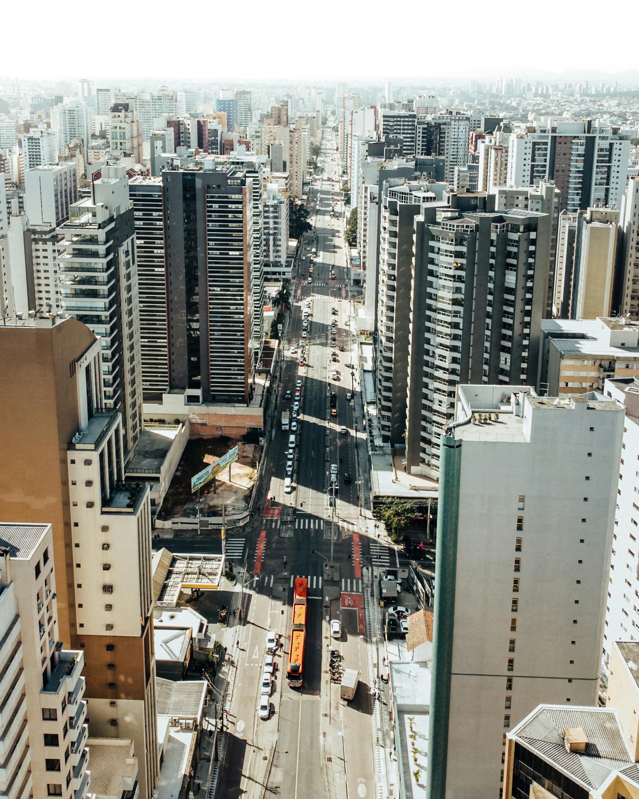 Aerial View of City Street Between High Rise Buildings · Free Stock Photo
