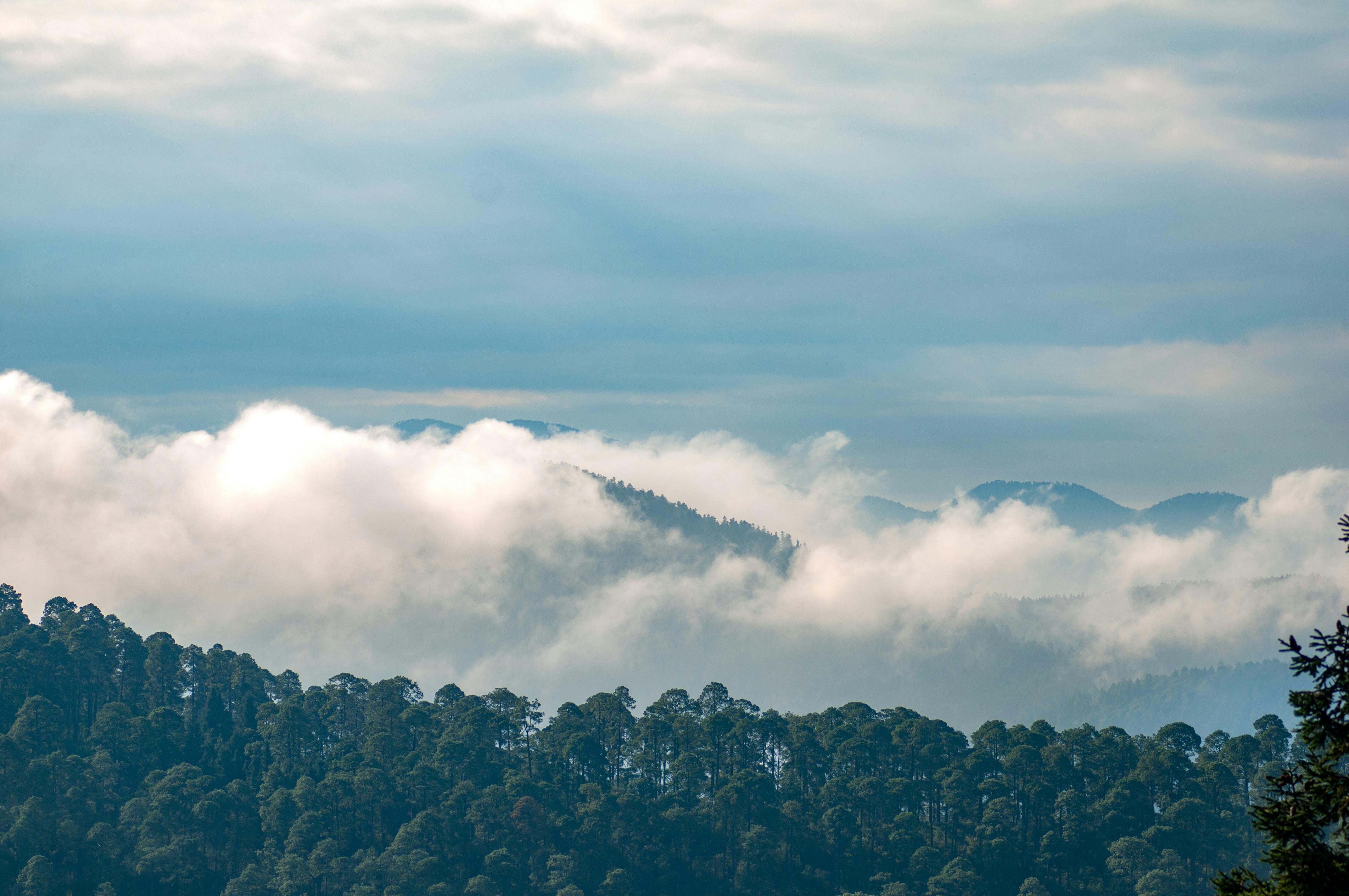 Mountain View Covered with White Clouds · Free Stock Photo