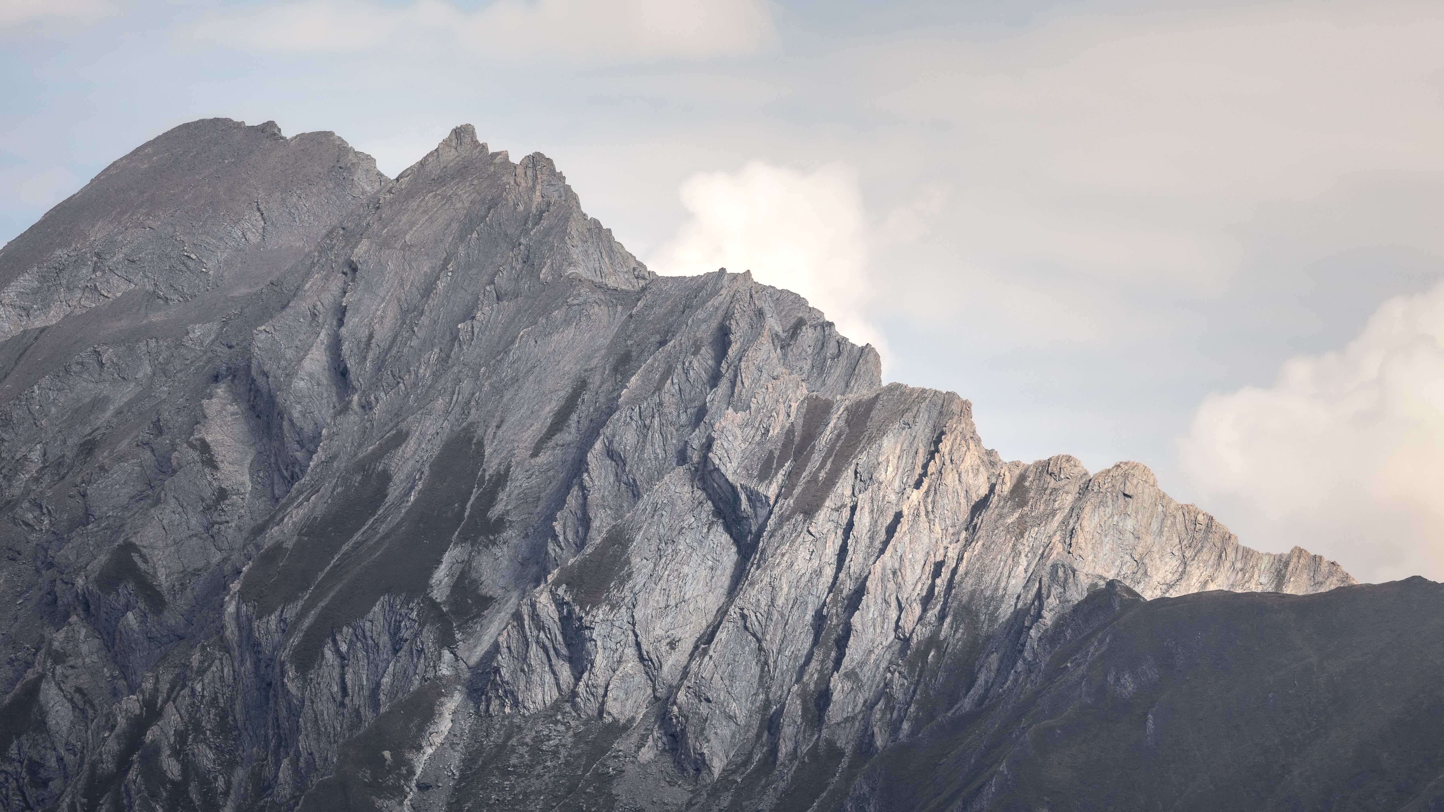 Gray Rocky Mountain Under White Clouds · Free Stock Photo