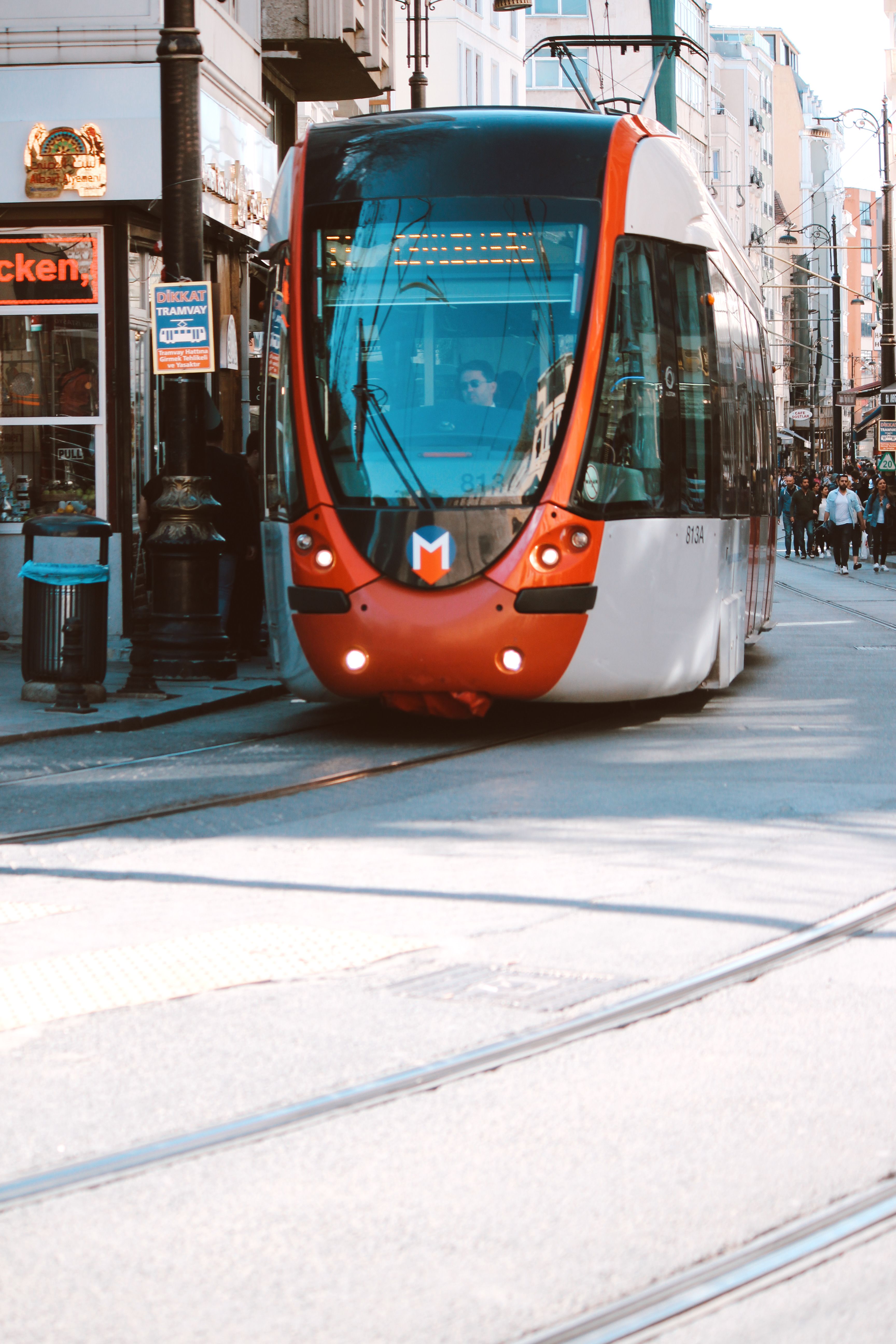 White and Black Tram on the Road · Free Stock Photo