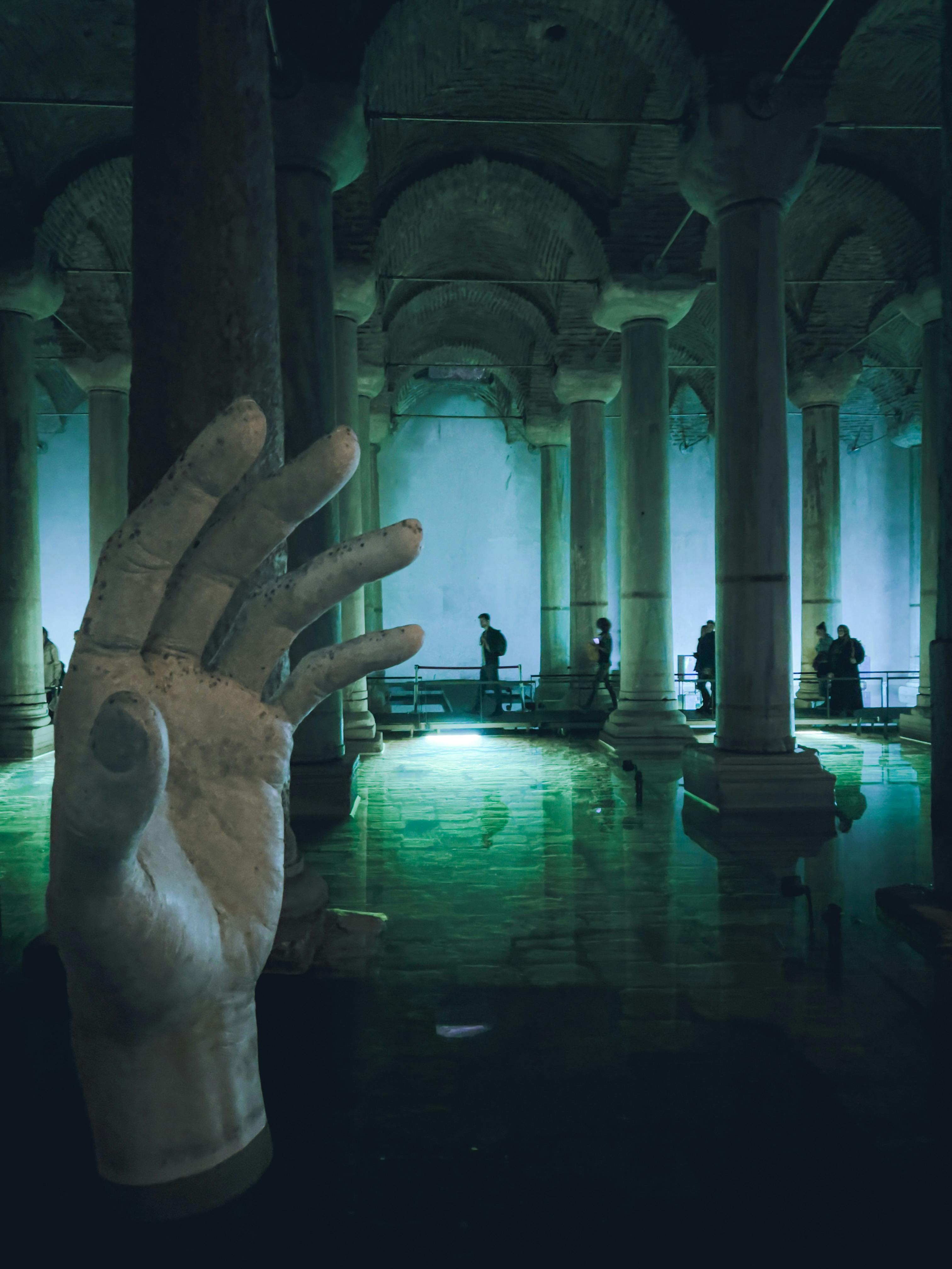 Huge Hand Sculpture in Museum Hall with Columns · Free Stock Photo