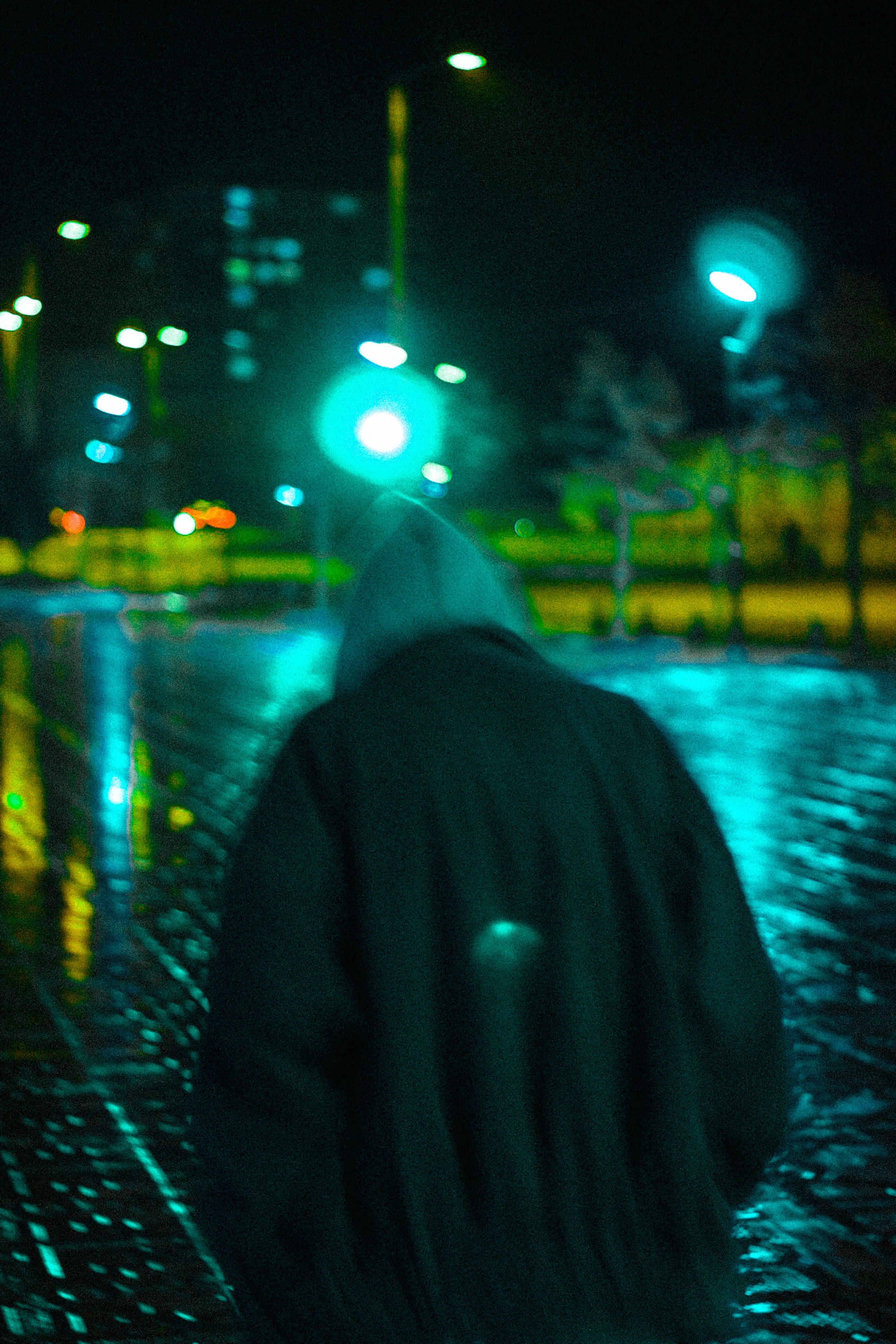 Back View of Person Wearing Hoodie Jacket While Walking on the Street ...