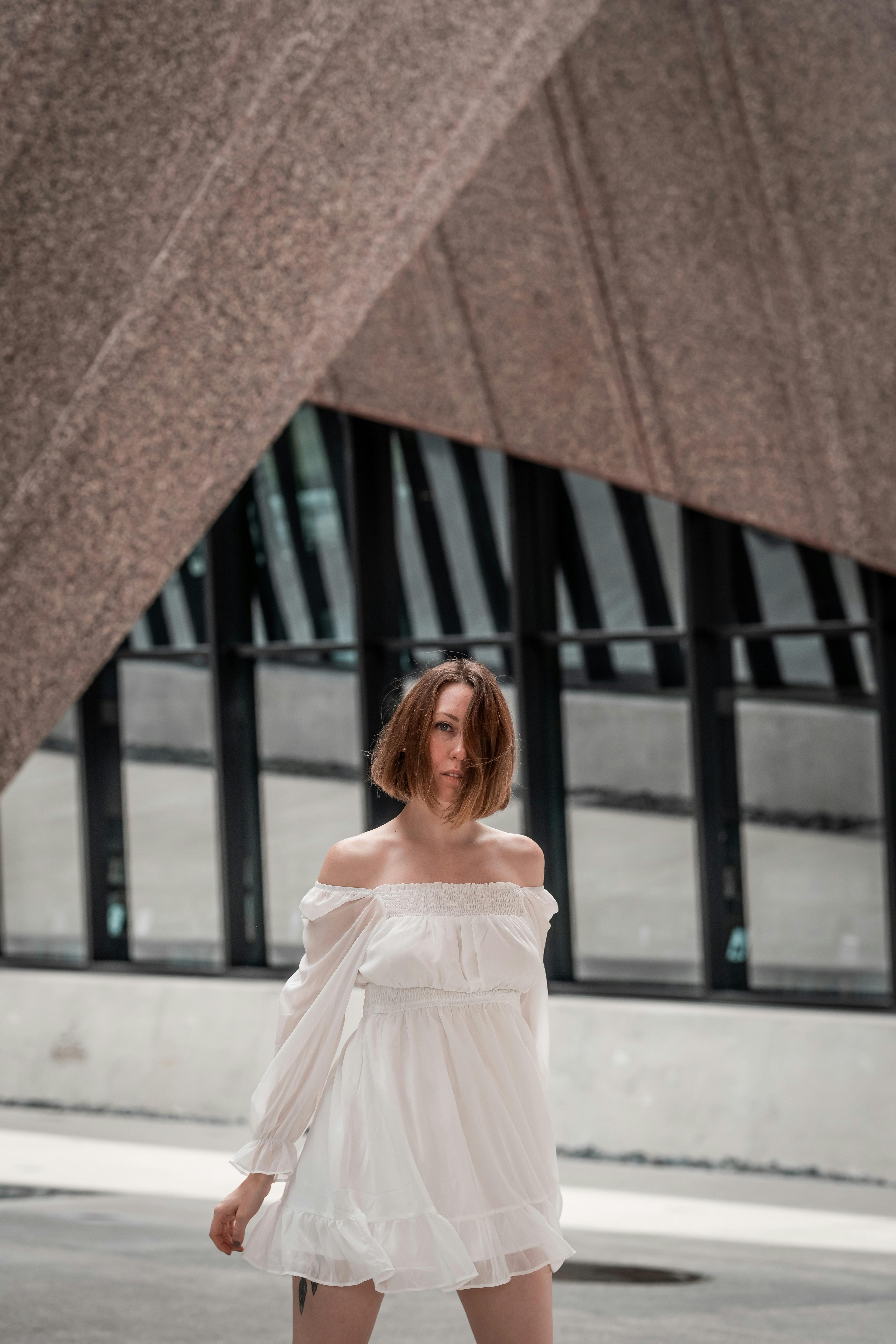 Pretty Woman Wearing a White Off Shoulder Dress · Free Stock Photo