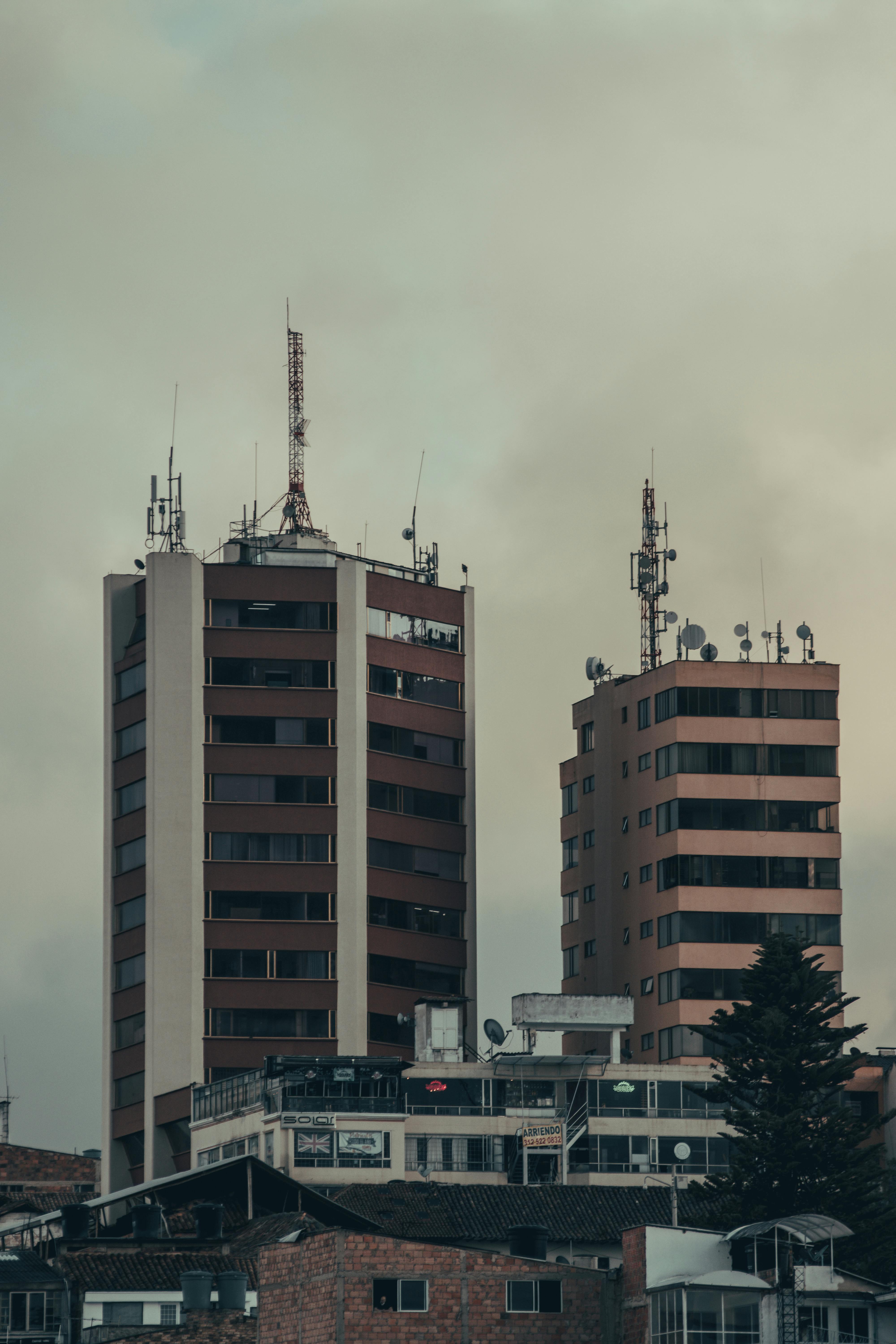 Telecommunication Towers on the Roof of the Buildings · Free Stock Photo