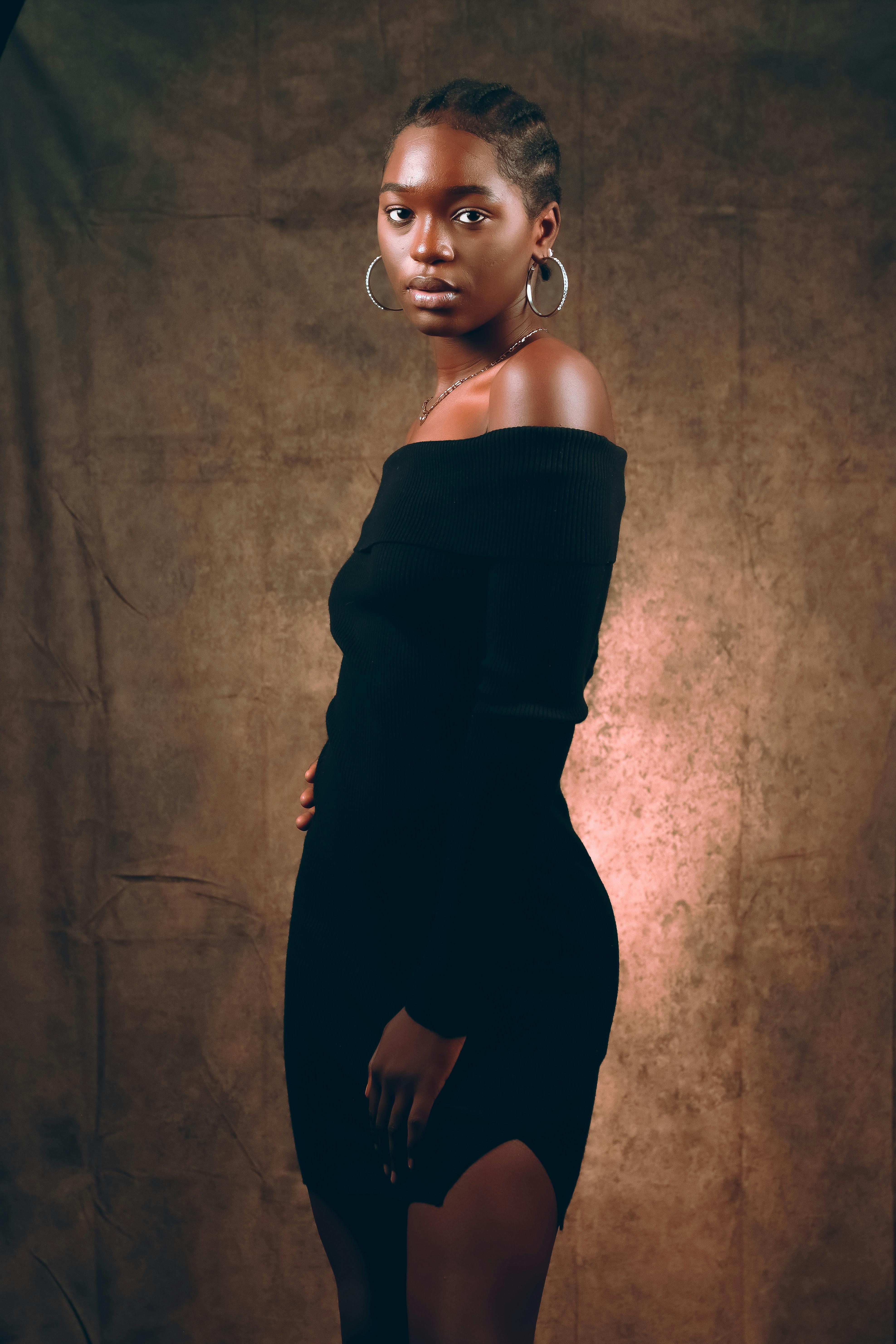 Model in a Long Black Evening Dress Posing on the Sidewalk · Free Stock ...