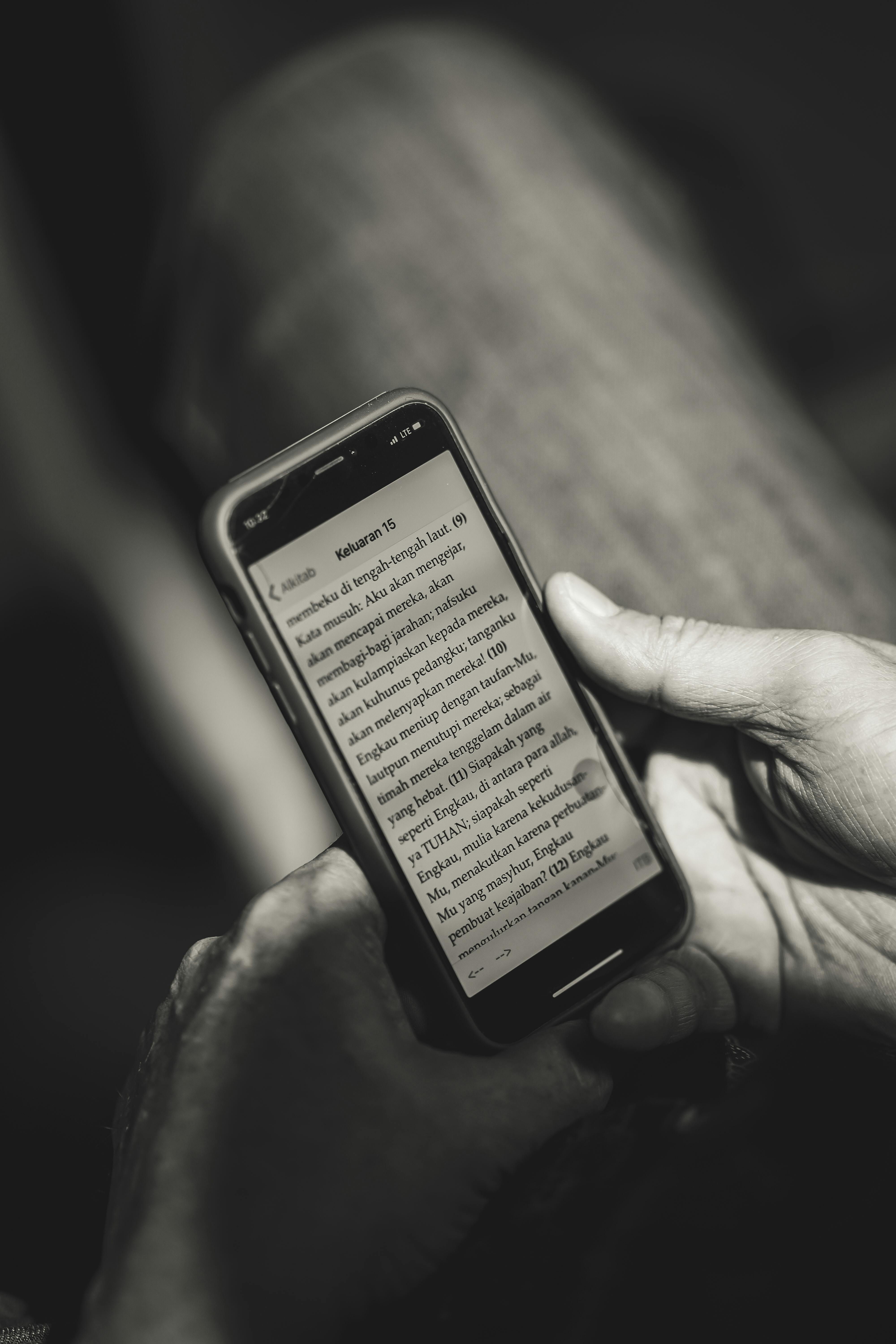 Photo of Hand Holding a Black Smartphone · Free Stock Photo