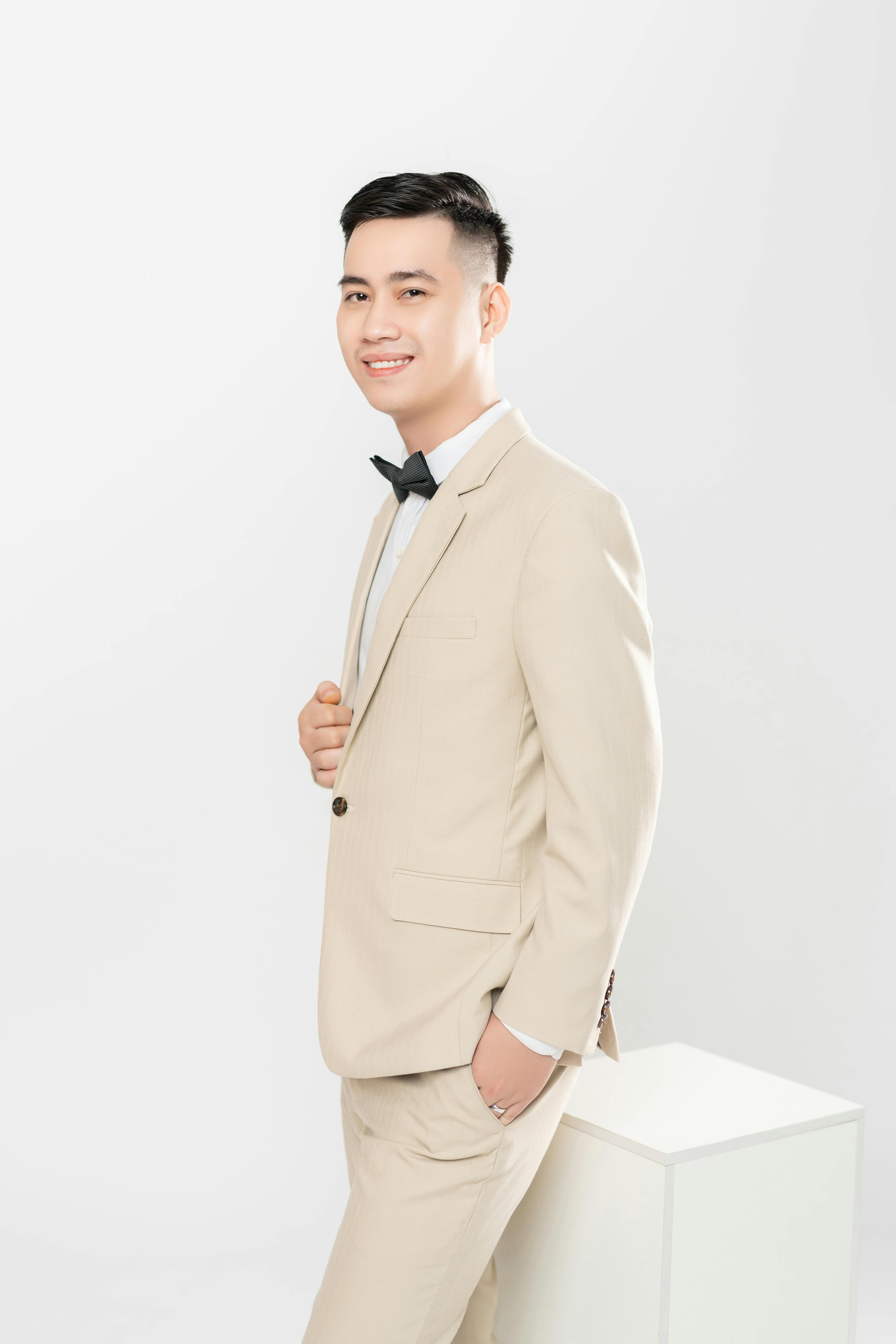Smiling Man in Formal Wear Posing on White Studio Background · Free ...