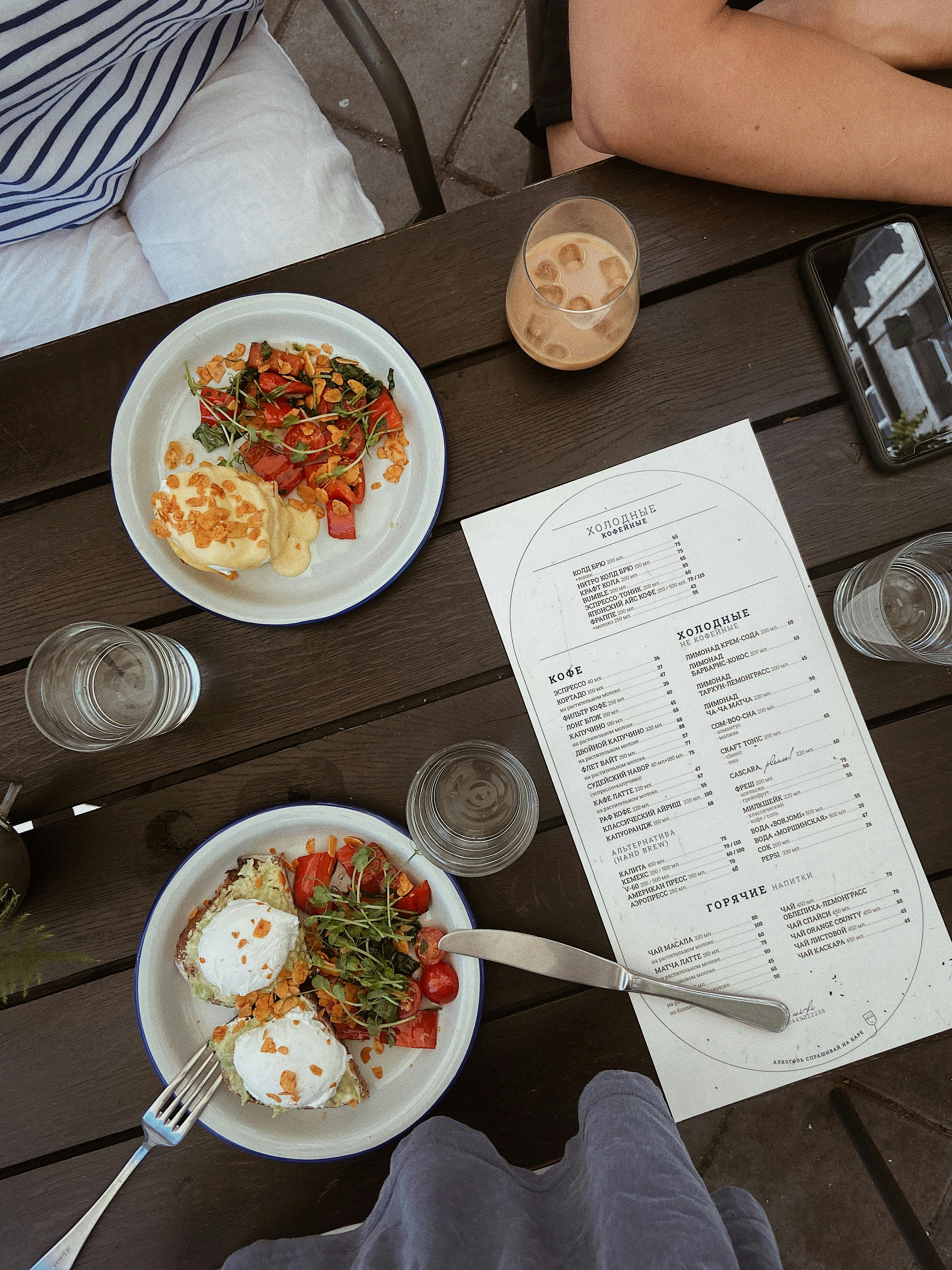 Plates and Menu on Table · Free Stock Photo