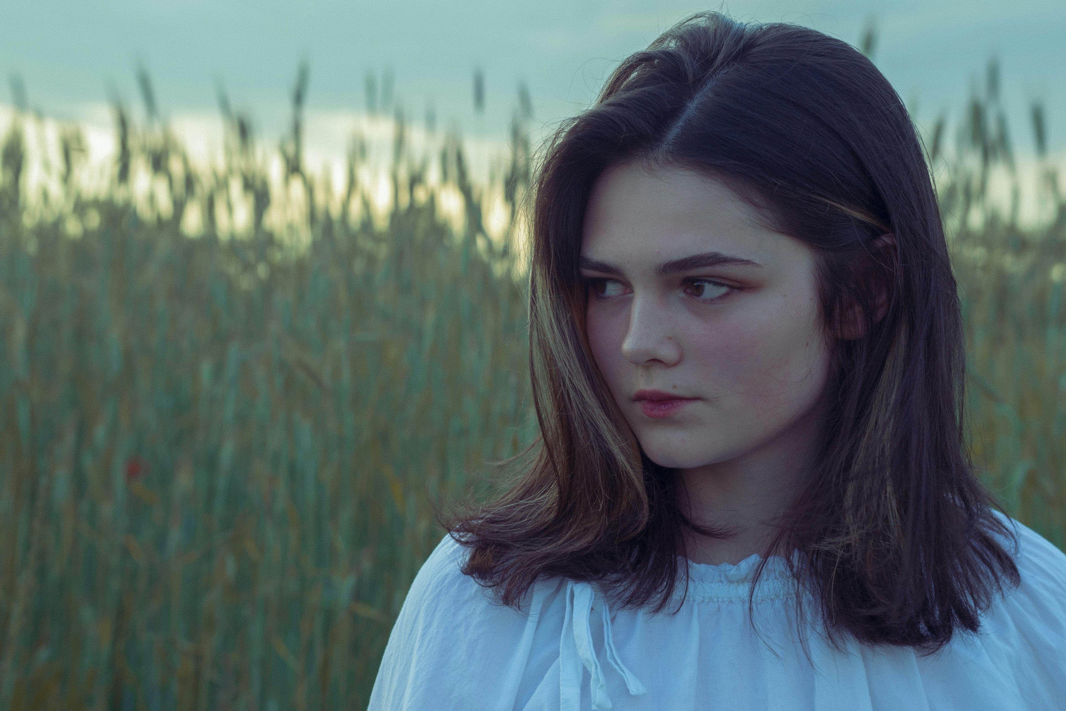 Portrait of a Girl Looking Sideways · Free Stock Photo