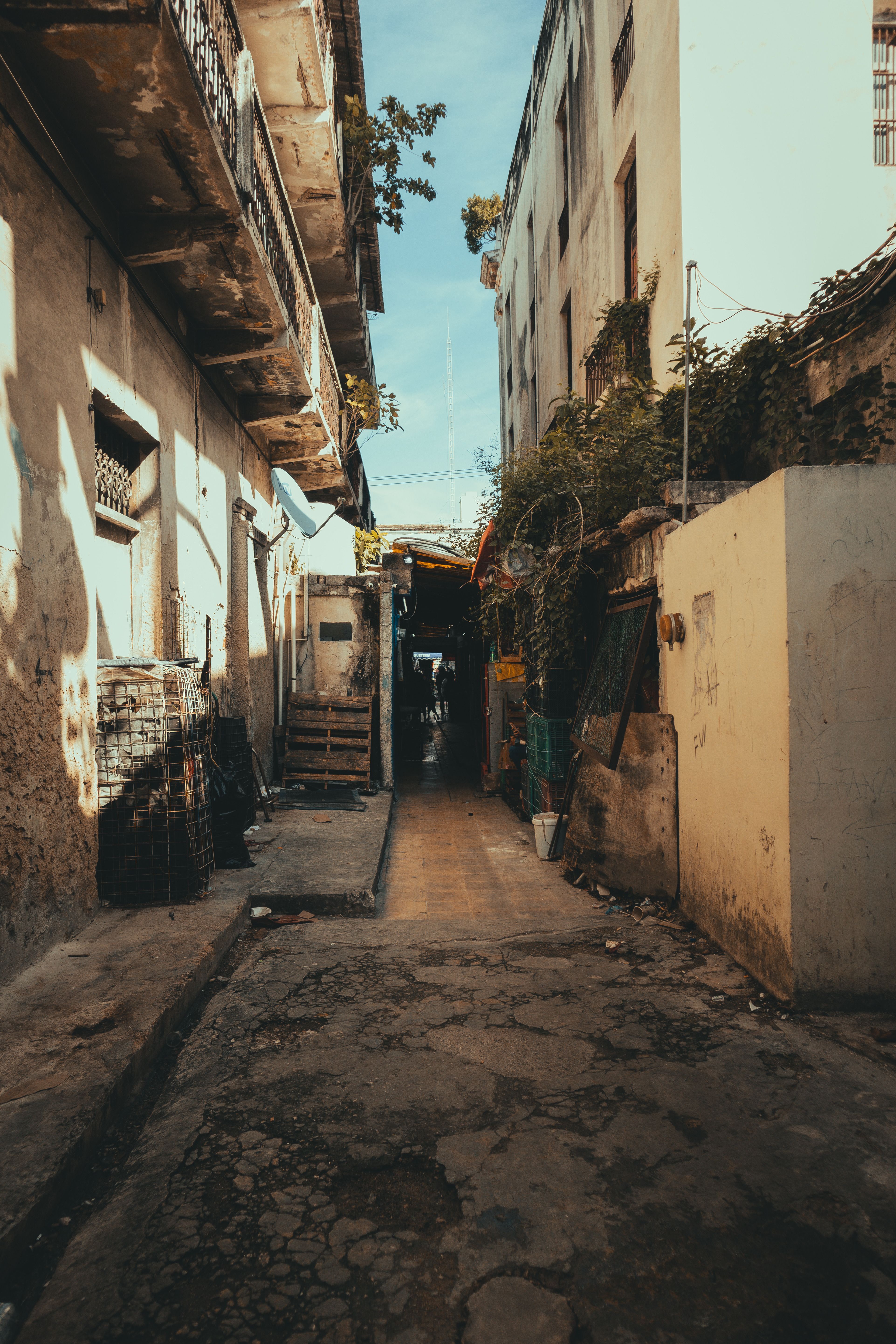 Narrow Alley Between Concrete Buildings · Free Stock Photo