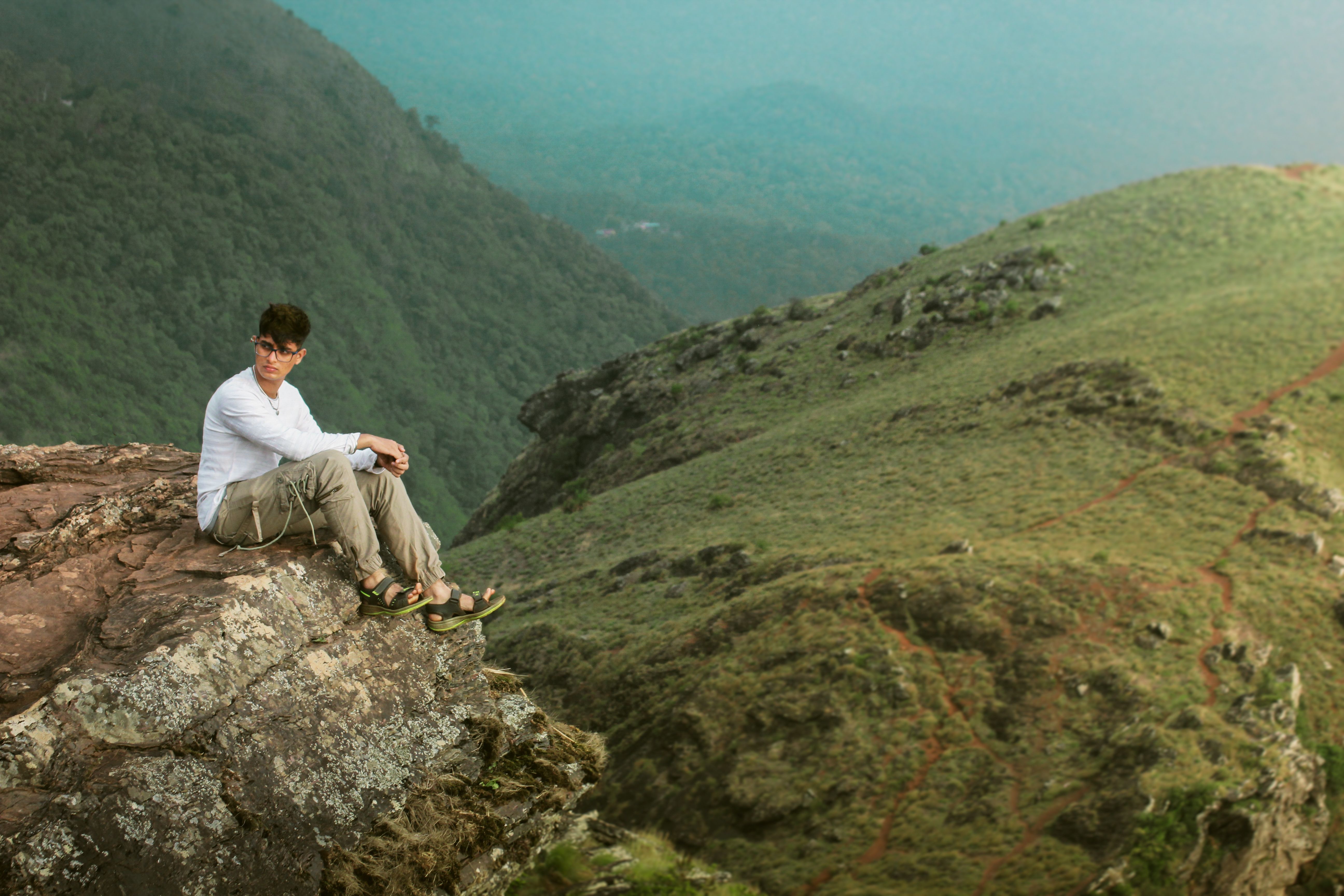A Man Sitting on the Rock · Free Stock Photo