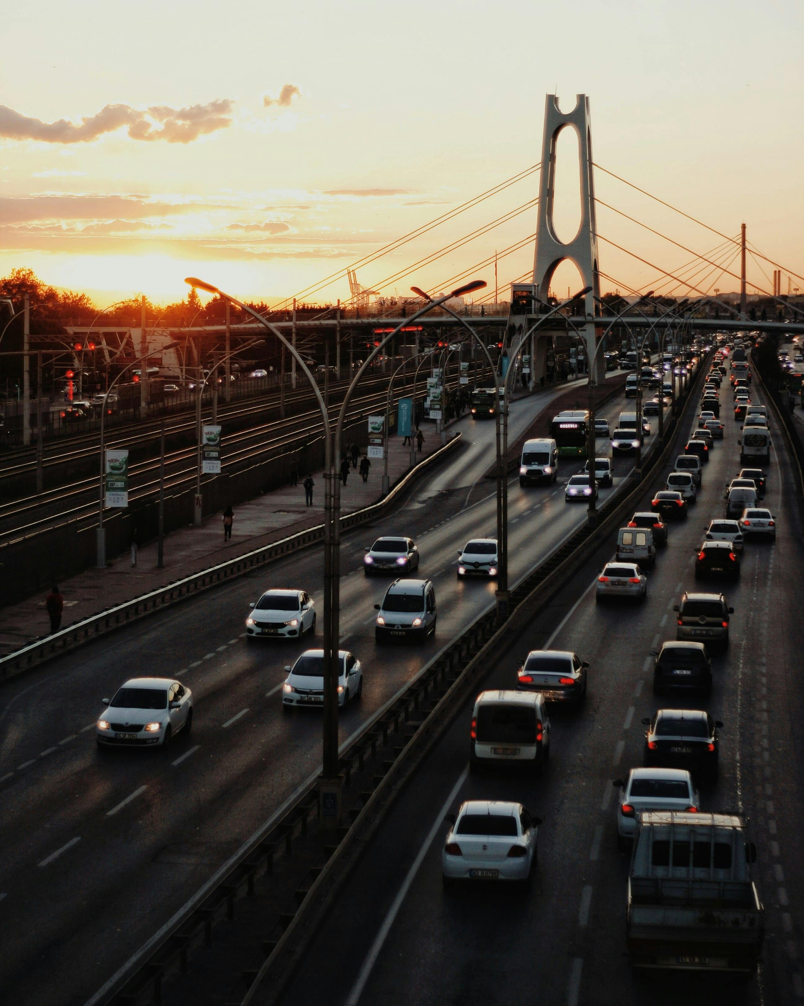 Overpass over Highway and Tracks at Sunset · Free Stock Photo