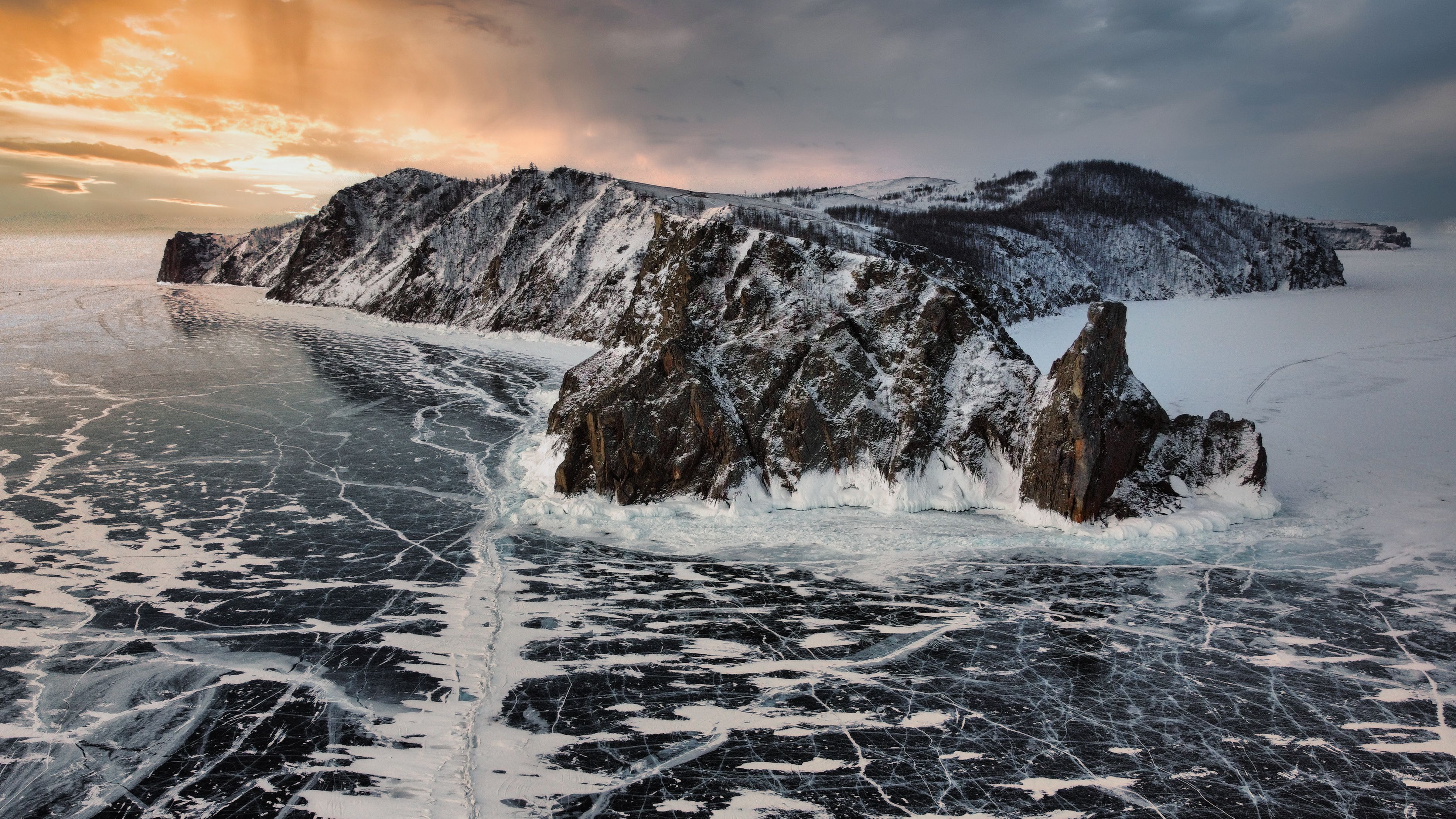 Snow Covered Mountain Beside a Frozen Lake · Free Stock Photo