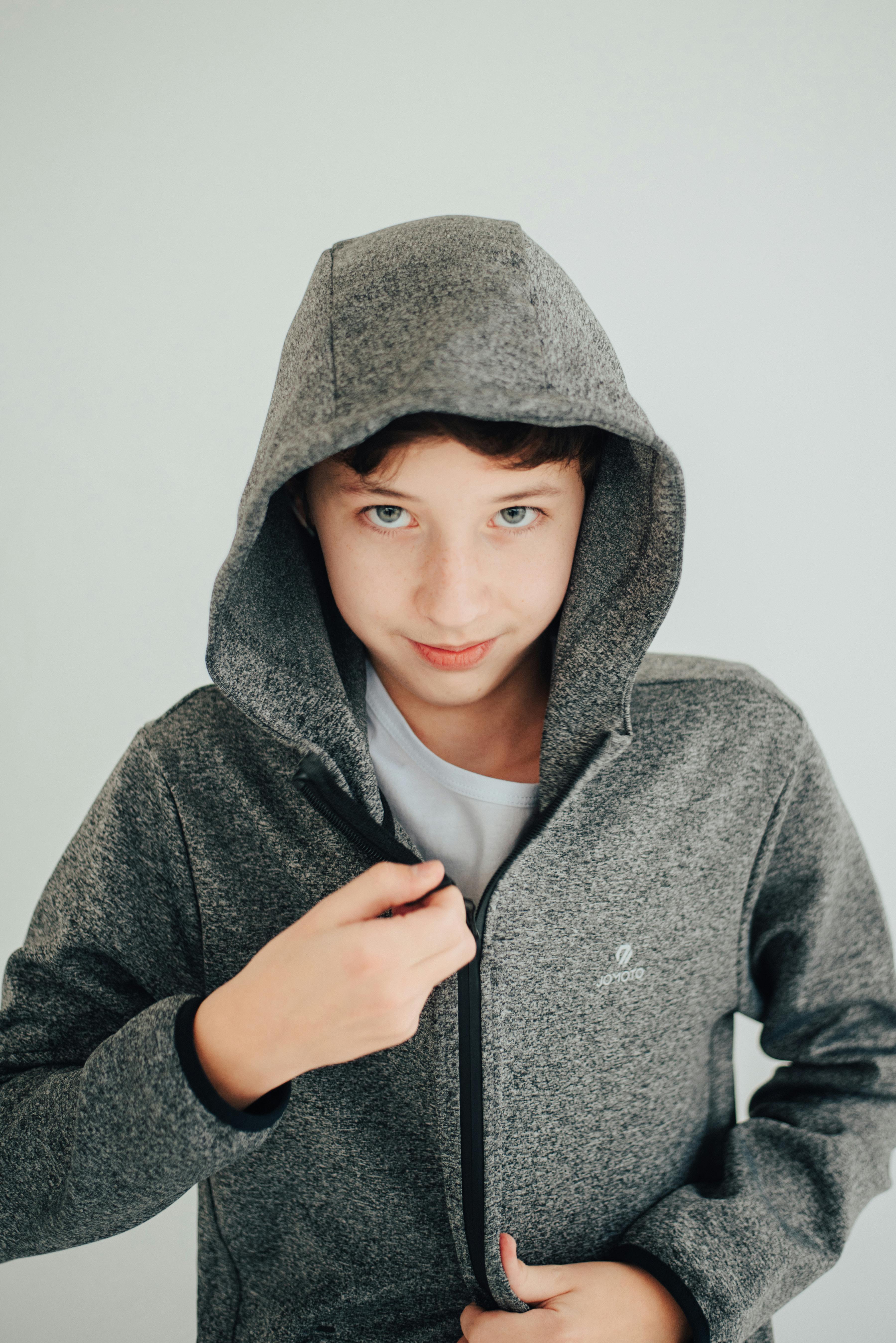 A Boy Wearing a Gray Jacket · Free Stock Photo