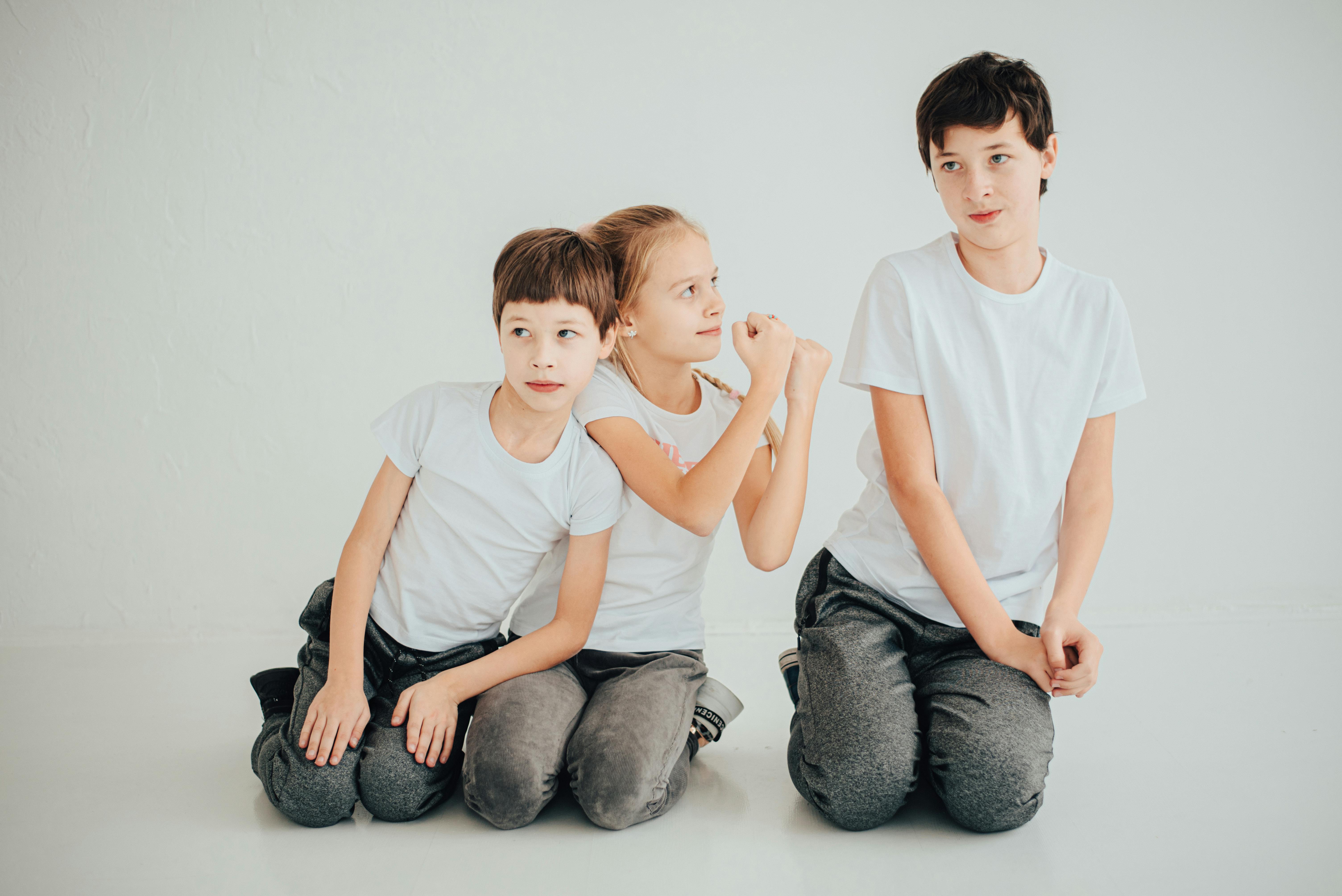 Three Siblings Doing a Photoshoot · Free Stock Photo