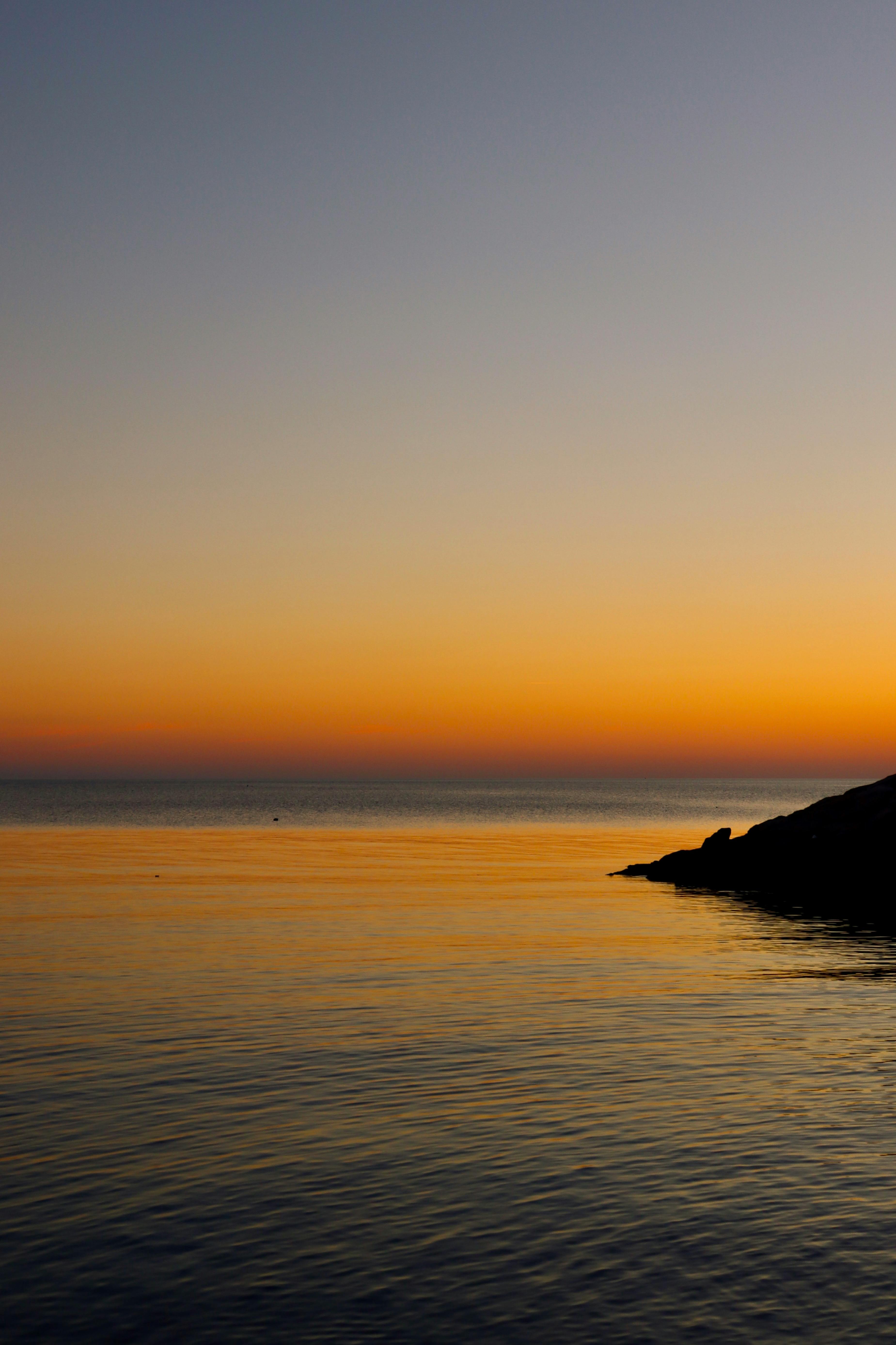 Sunset Over Body of Water · Free Stock Photo