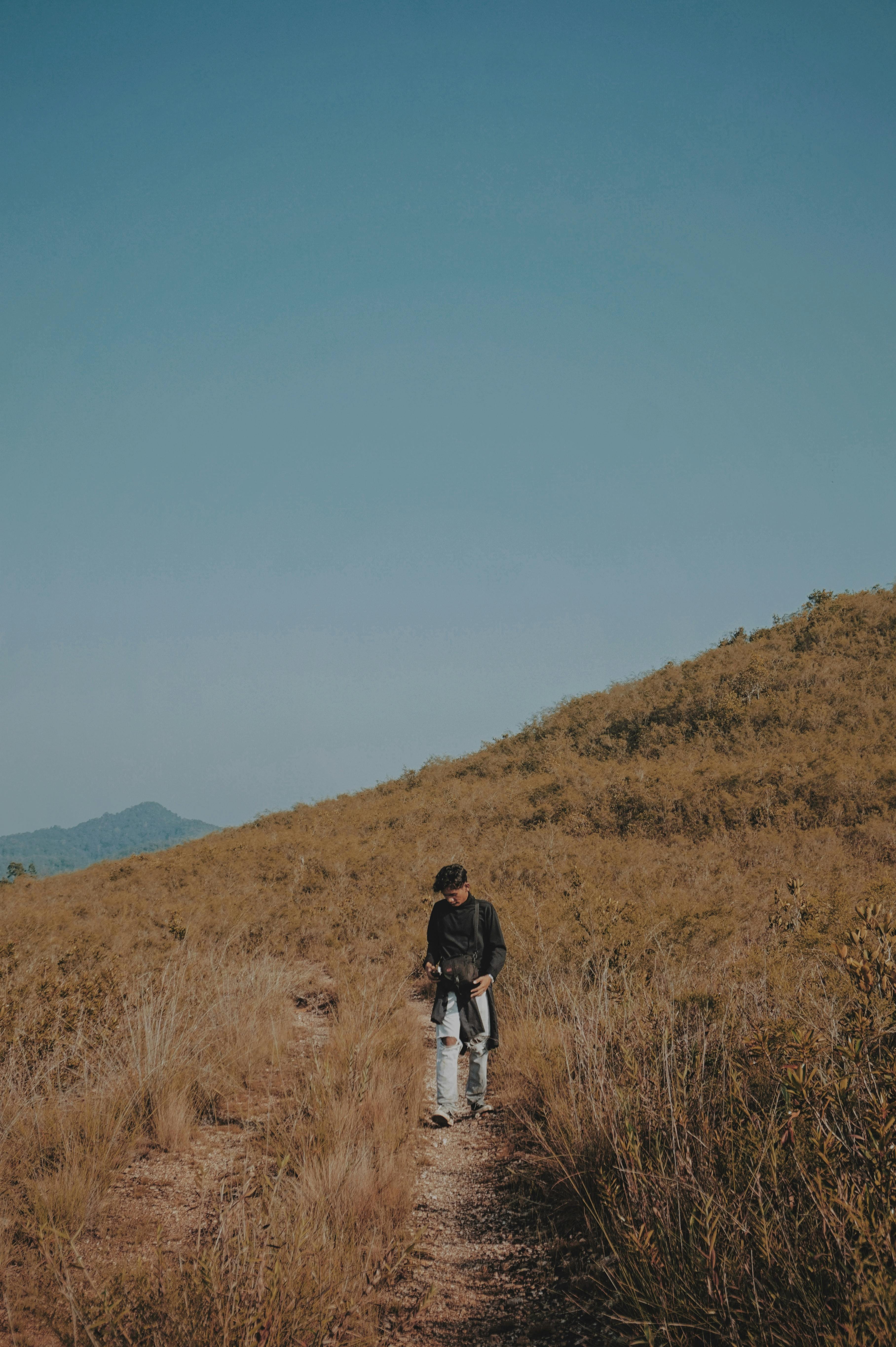Man Walking on a Pathway at the Hill · Free Stock Photo