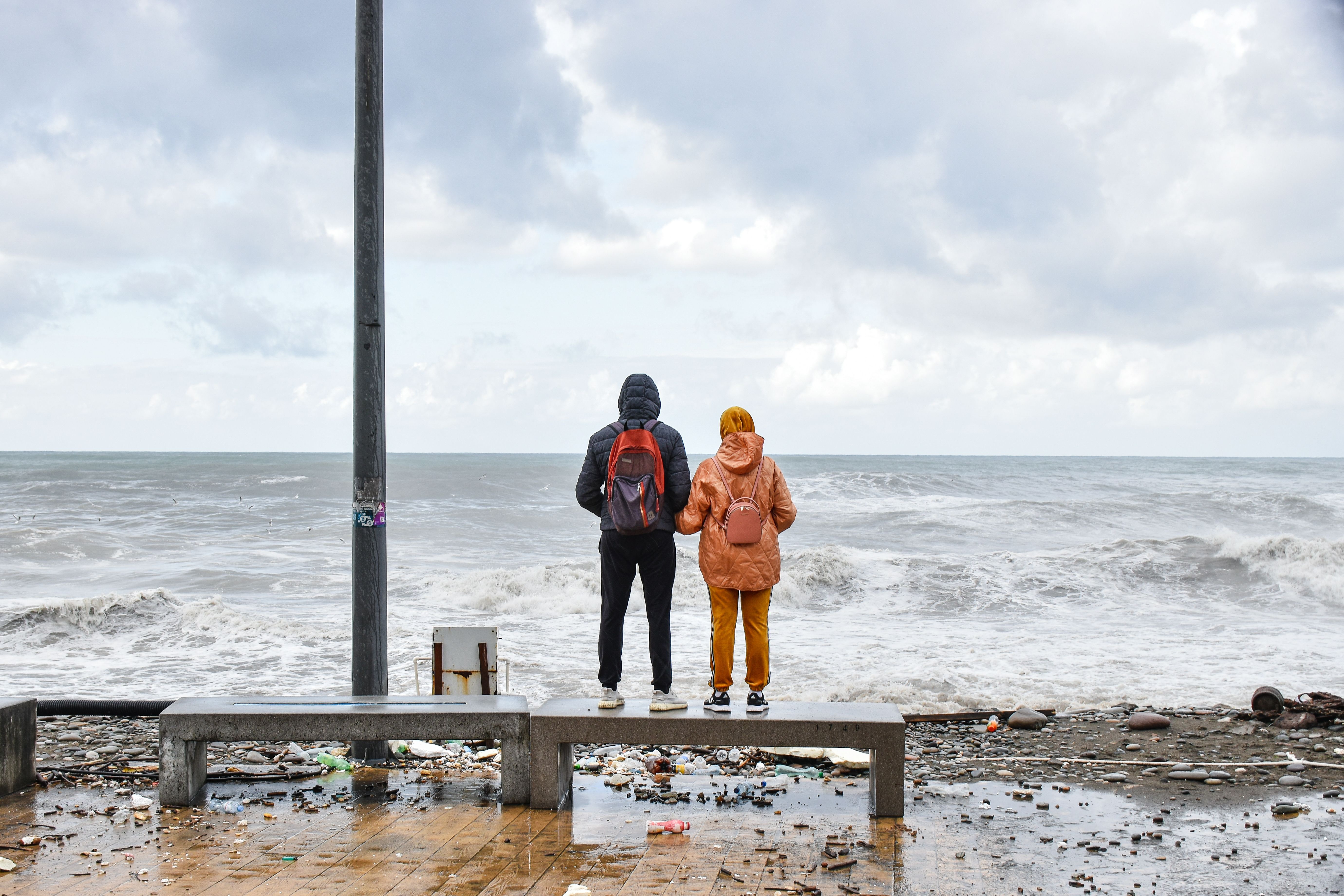 Man and Woman Standing on a Bench · Free Stock Photo