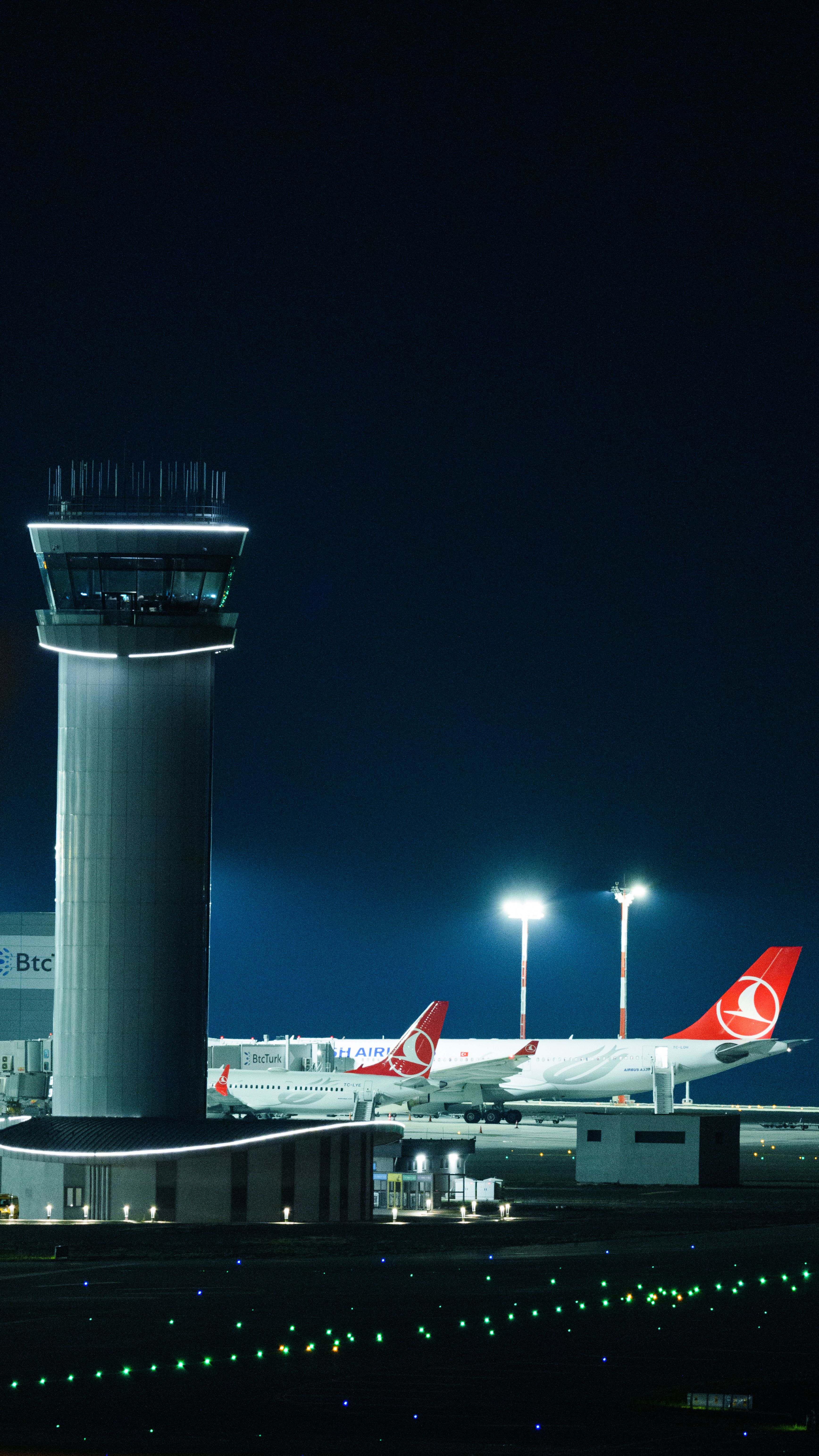Turkish Airlines Airplanes on an Airport at Night · Free Stock Photo