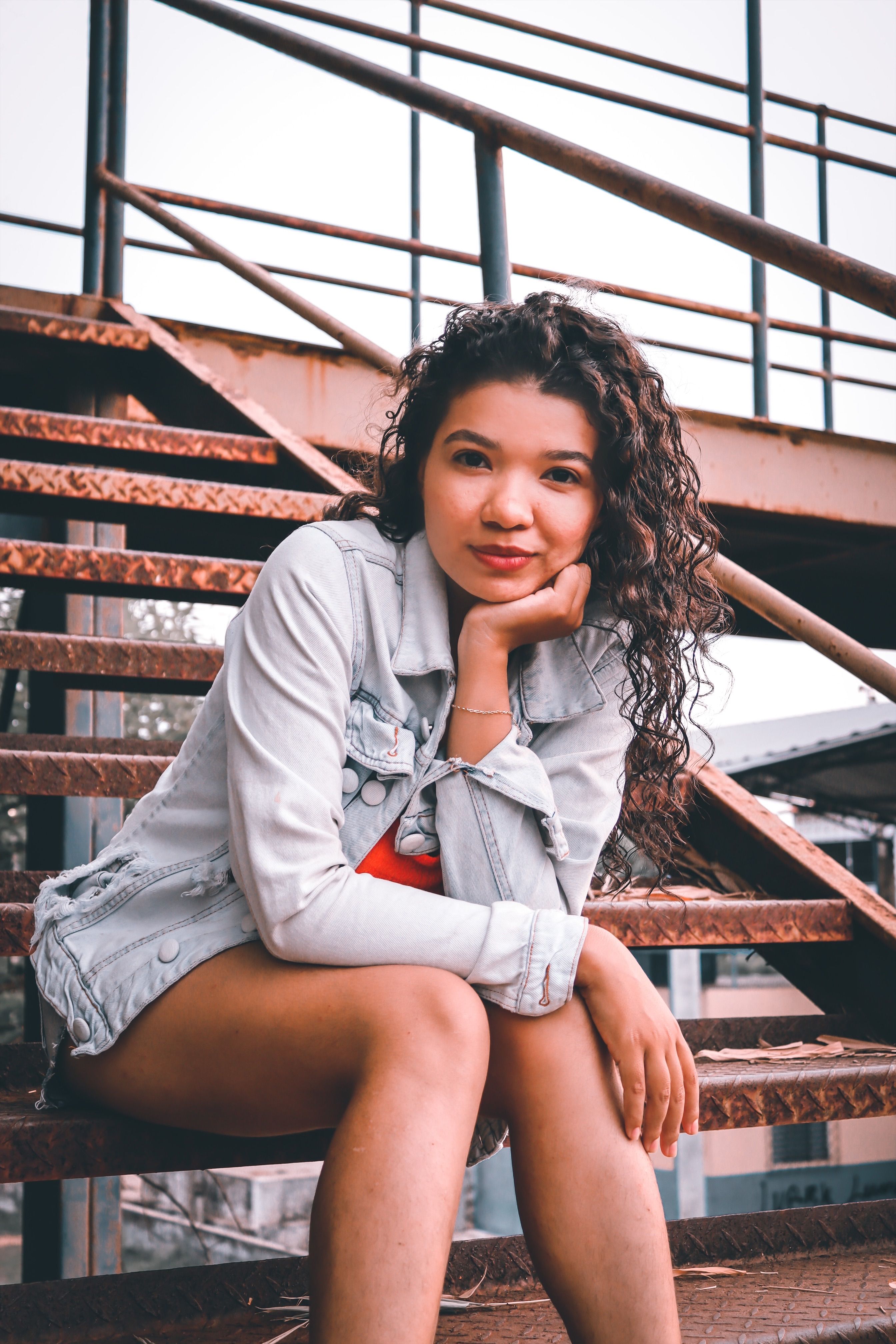 Woman Sitting and Posing on Stairs · Free Stock Photo