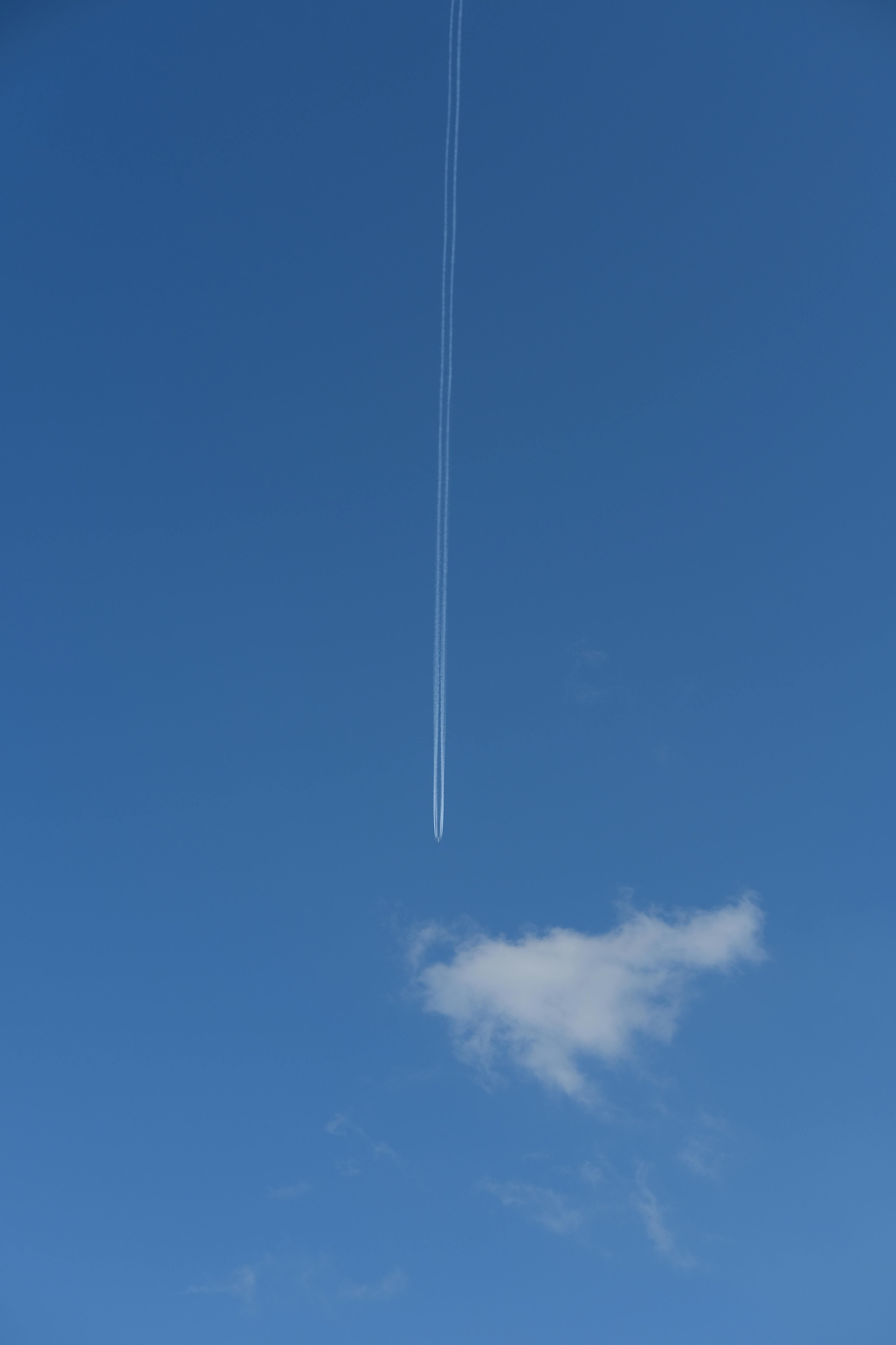 Contrails behind an Airplane against Blue Sky · Free Stock Photo