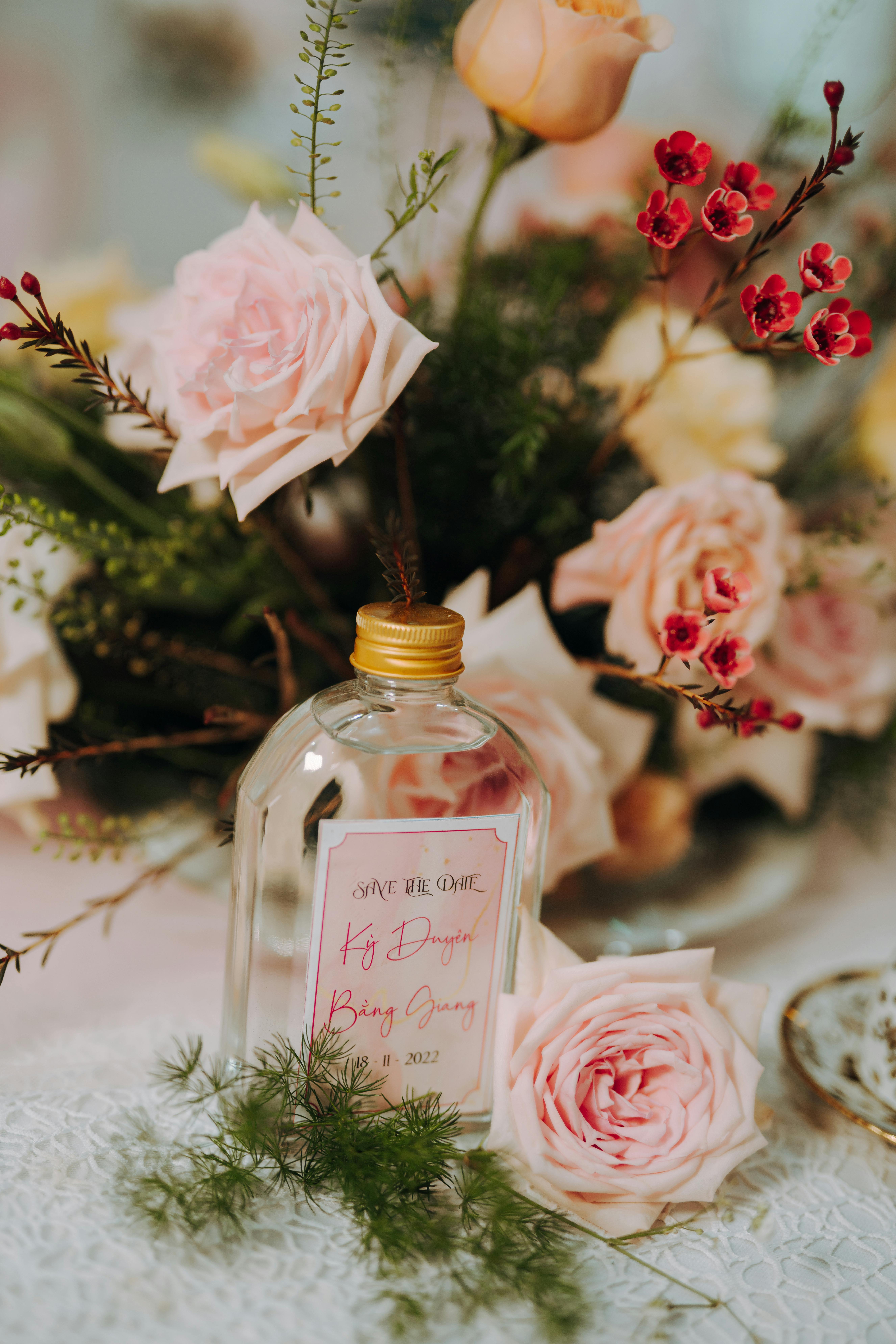 Flowers and Vial · Free Stock Photo
