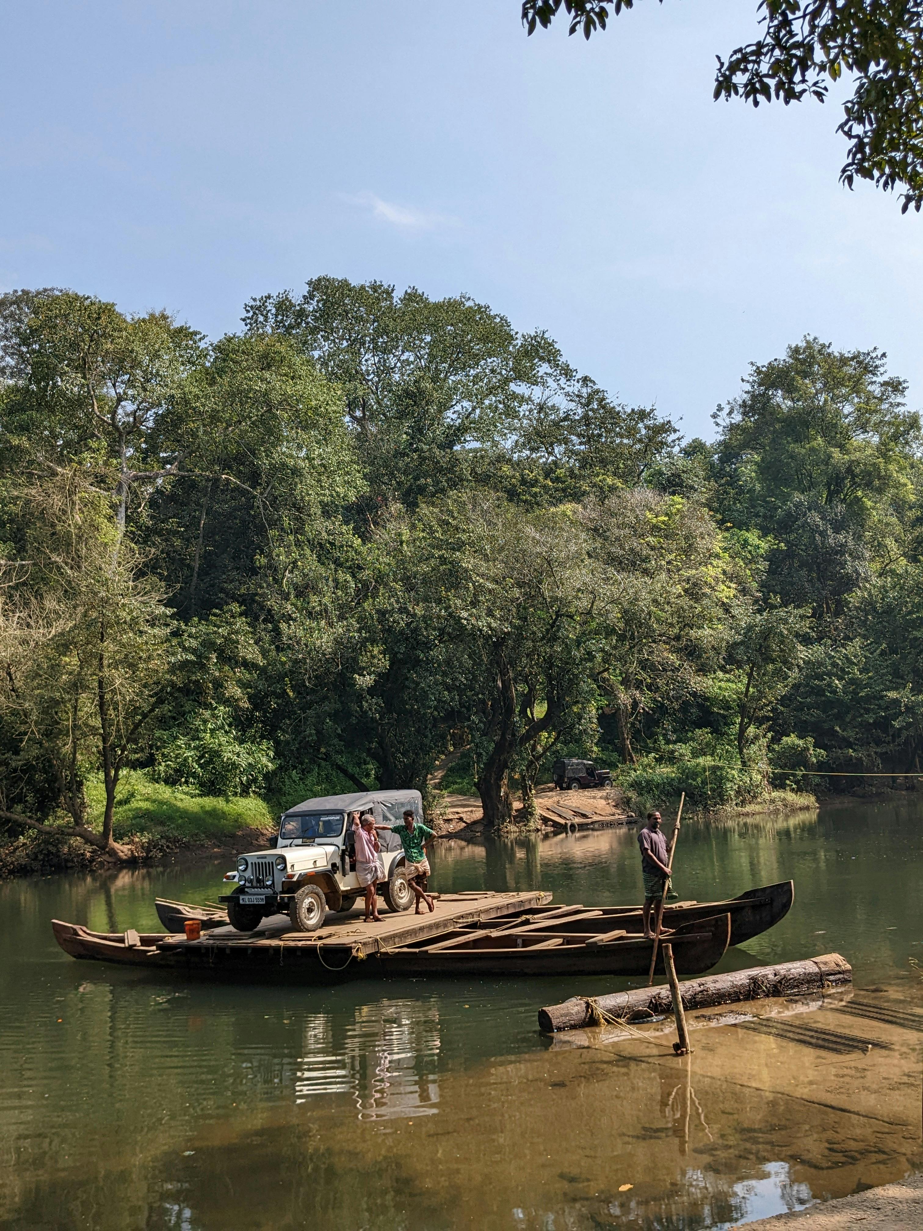 Men with Offroad Car Standing on Raft in River · Free Stock Photo