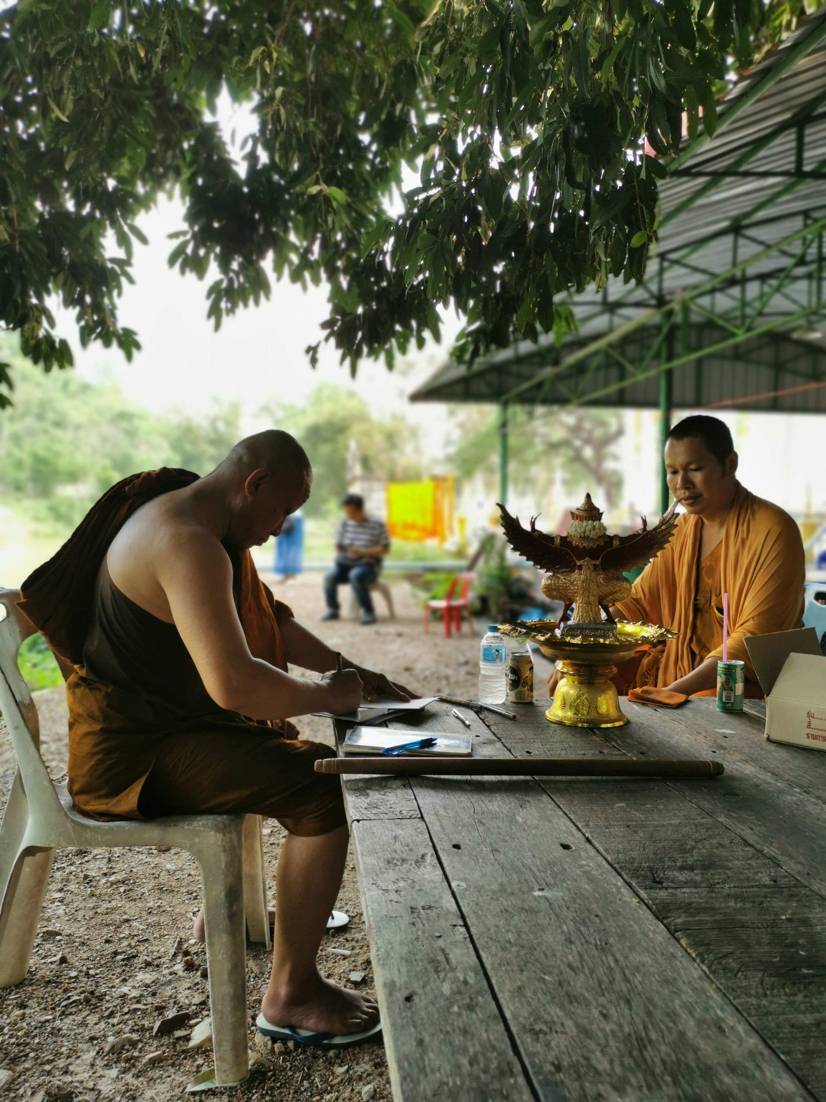 Monks Sitting by Table · Free Stock Photo