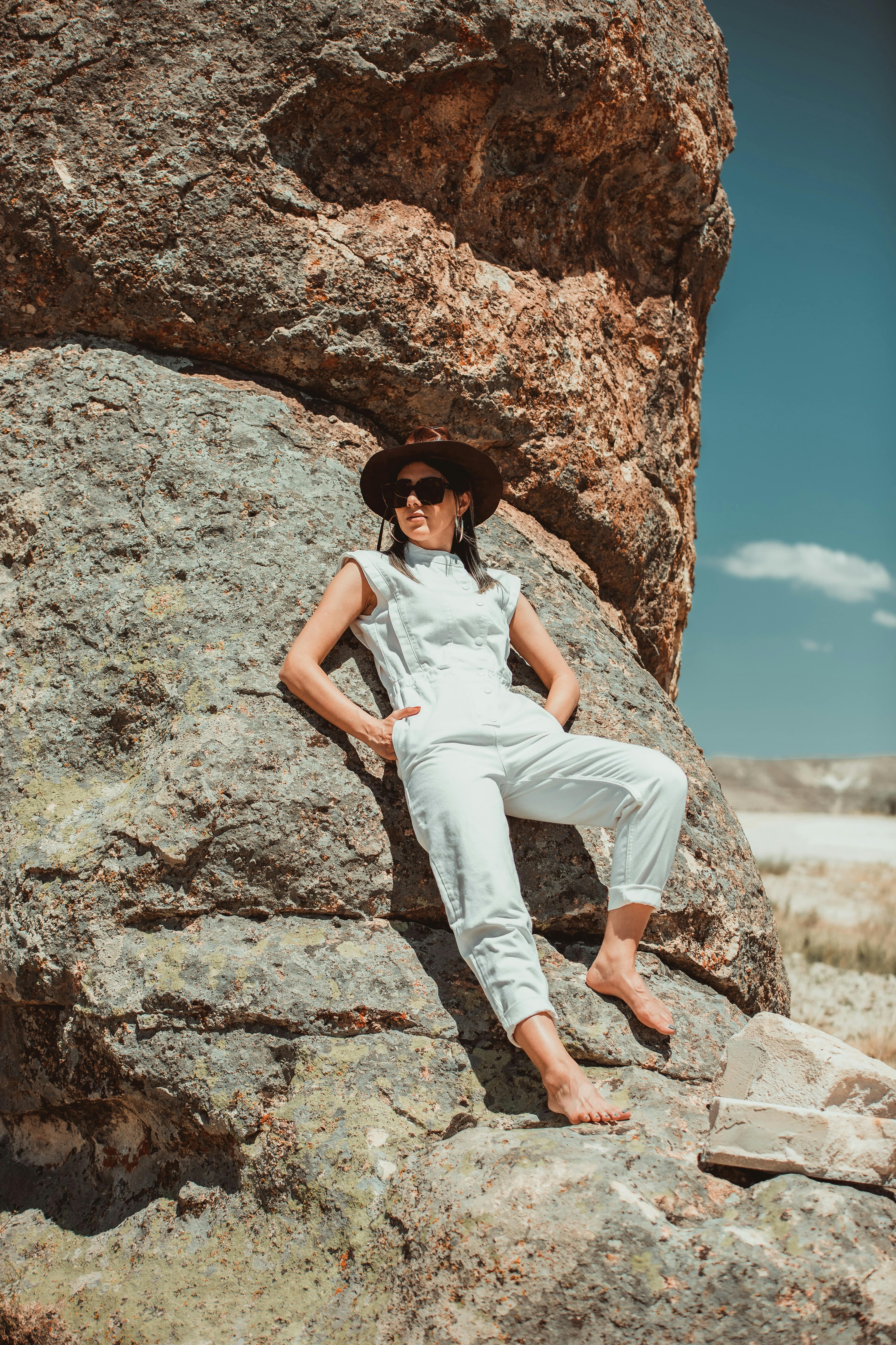 Woman Leaning on Rock · Free Stock Photo