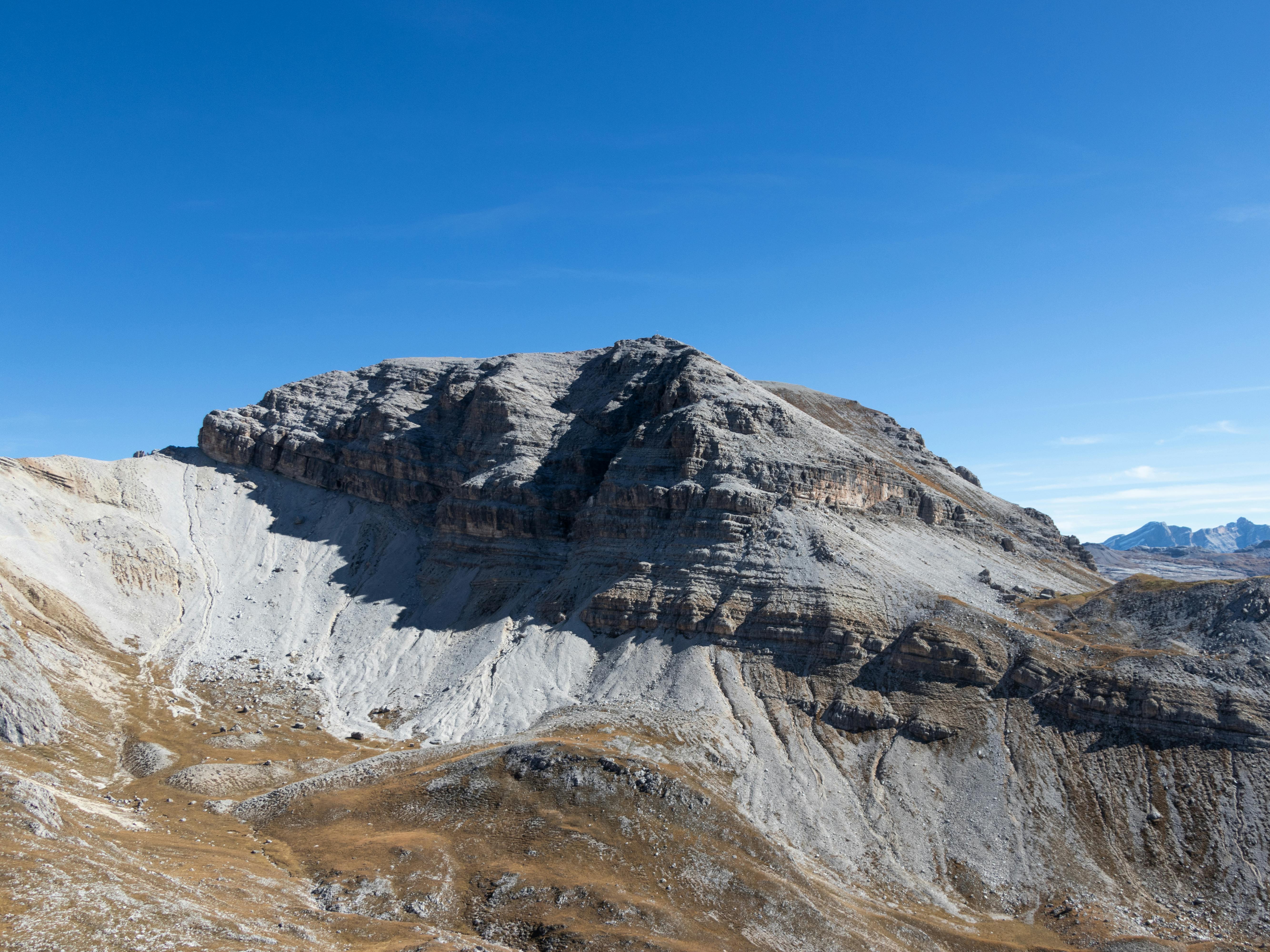 Gray Rocky Mountain under Blue Sky · Free Stock Photo
