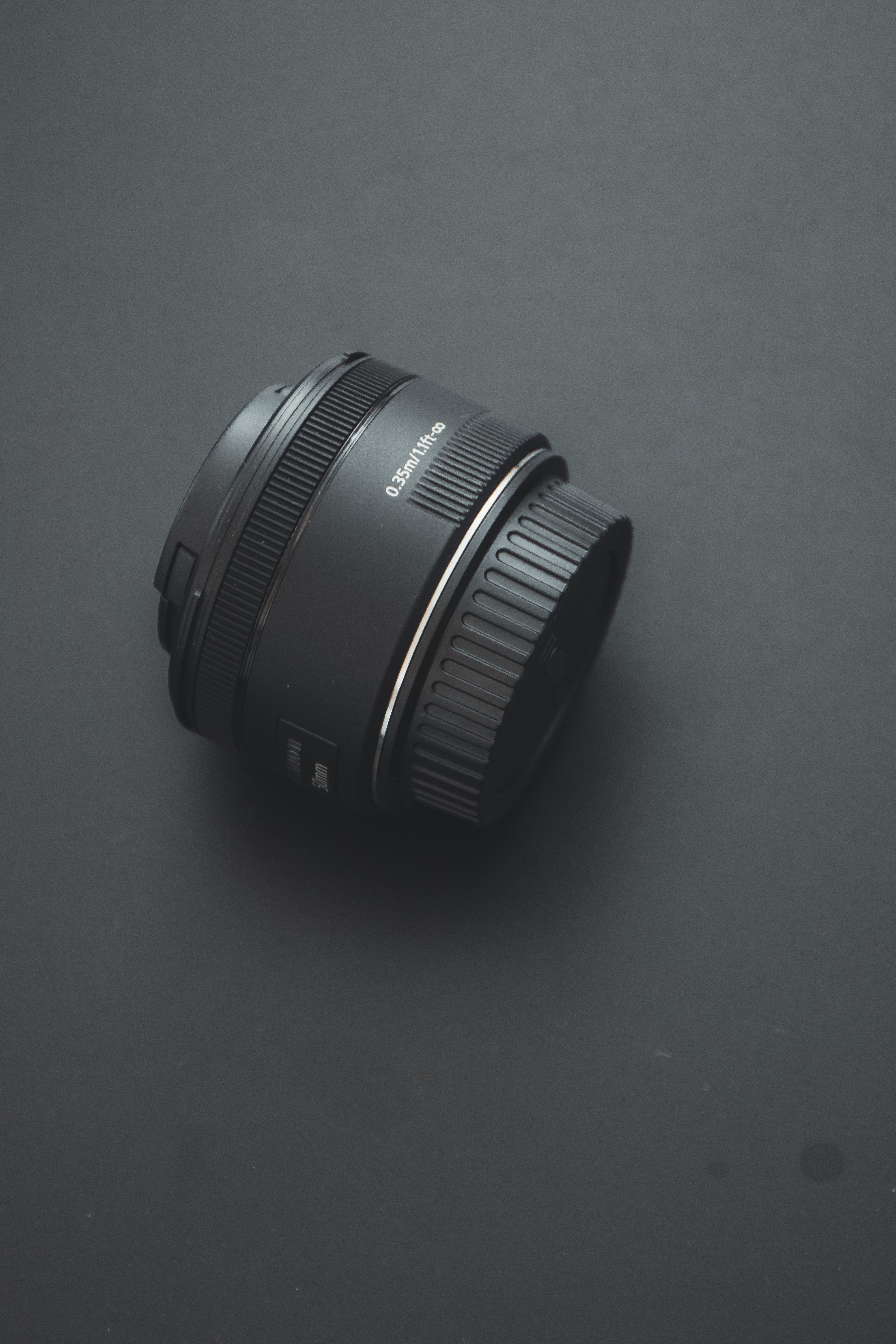 Photo of a Camera Standing on a Lens · Free Stock Photo