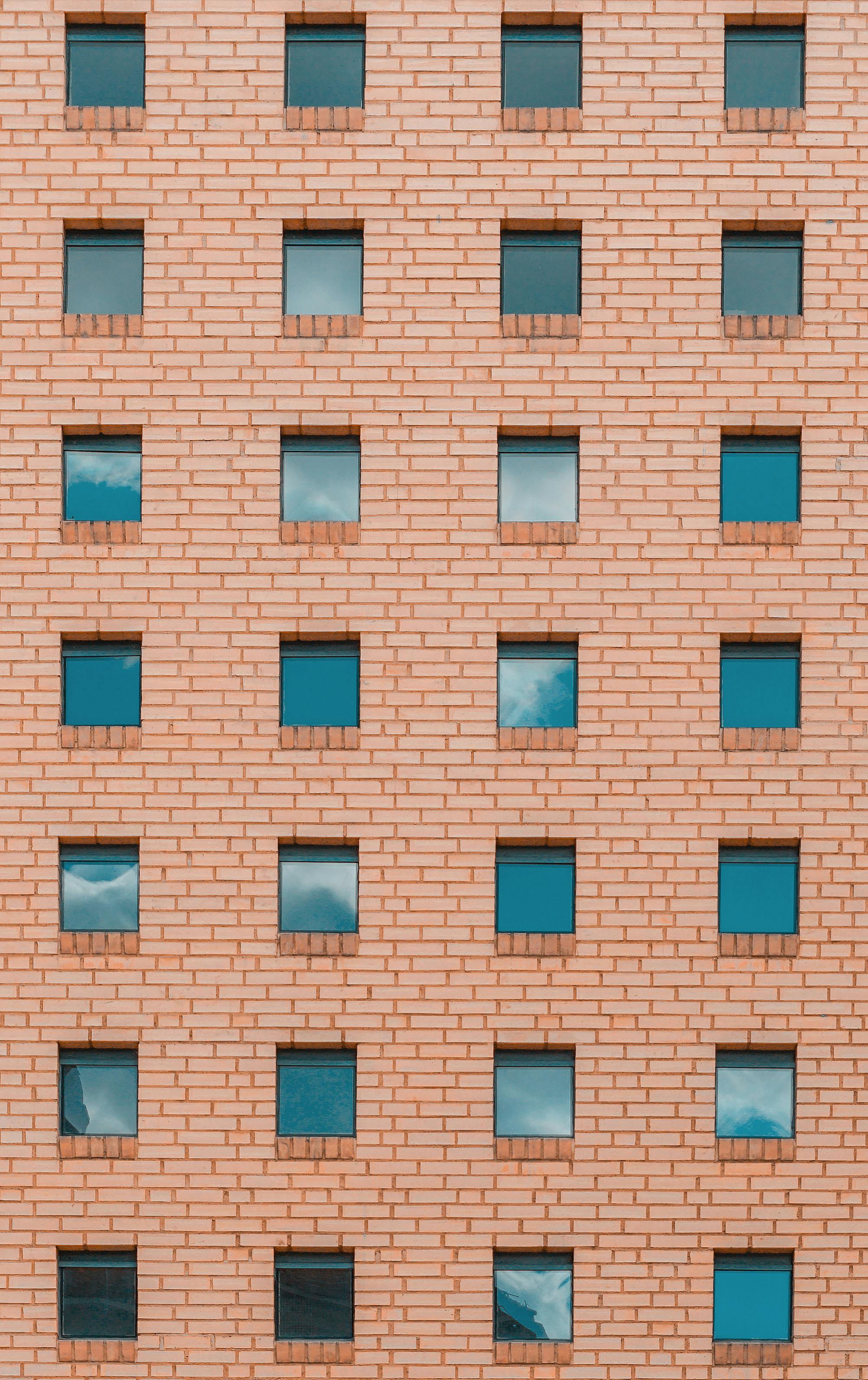 Windows of a Brick Building · Free Stock Photo