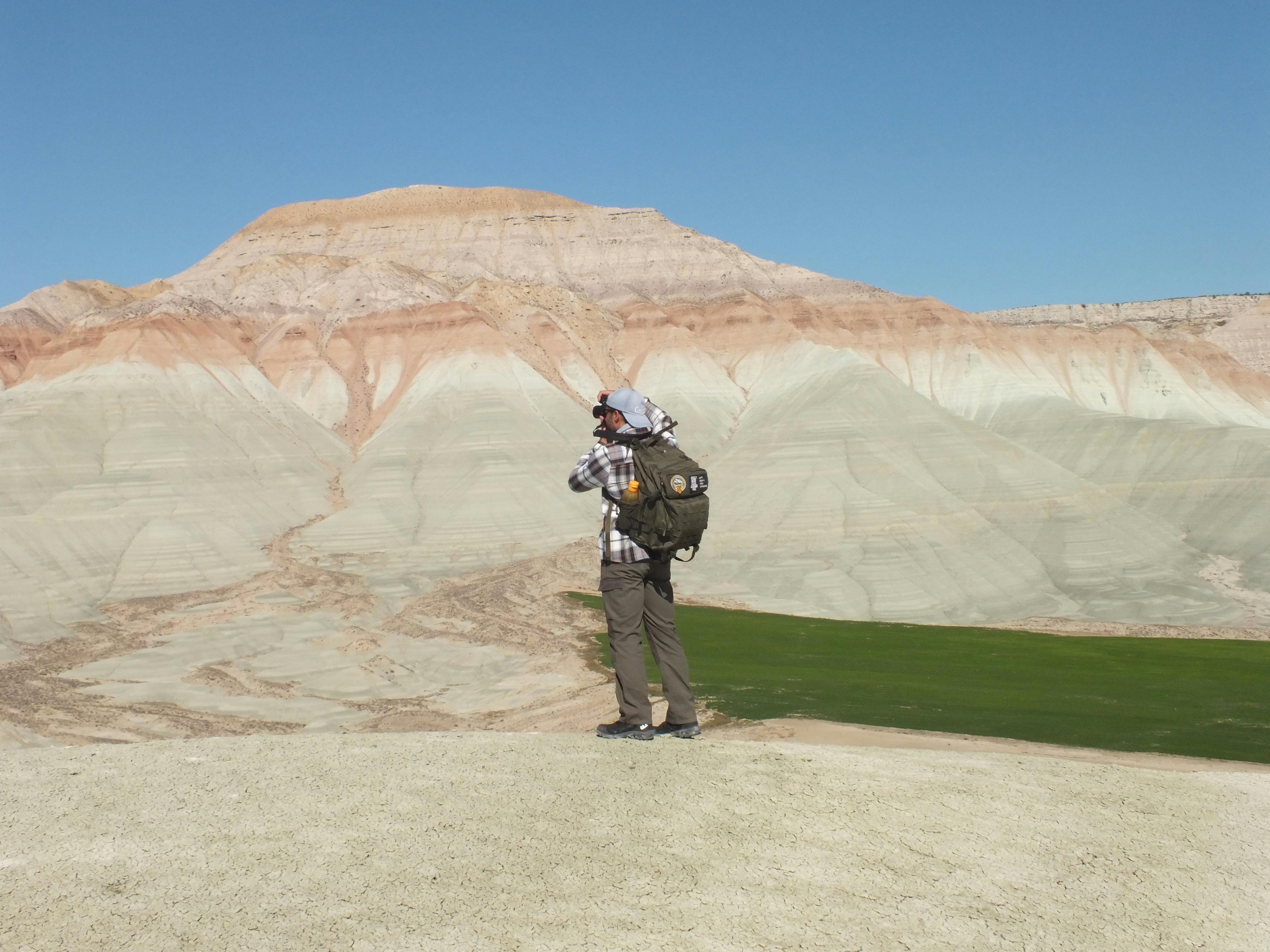 Man Photographing in Desert Landscape · Free Stock Photo
