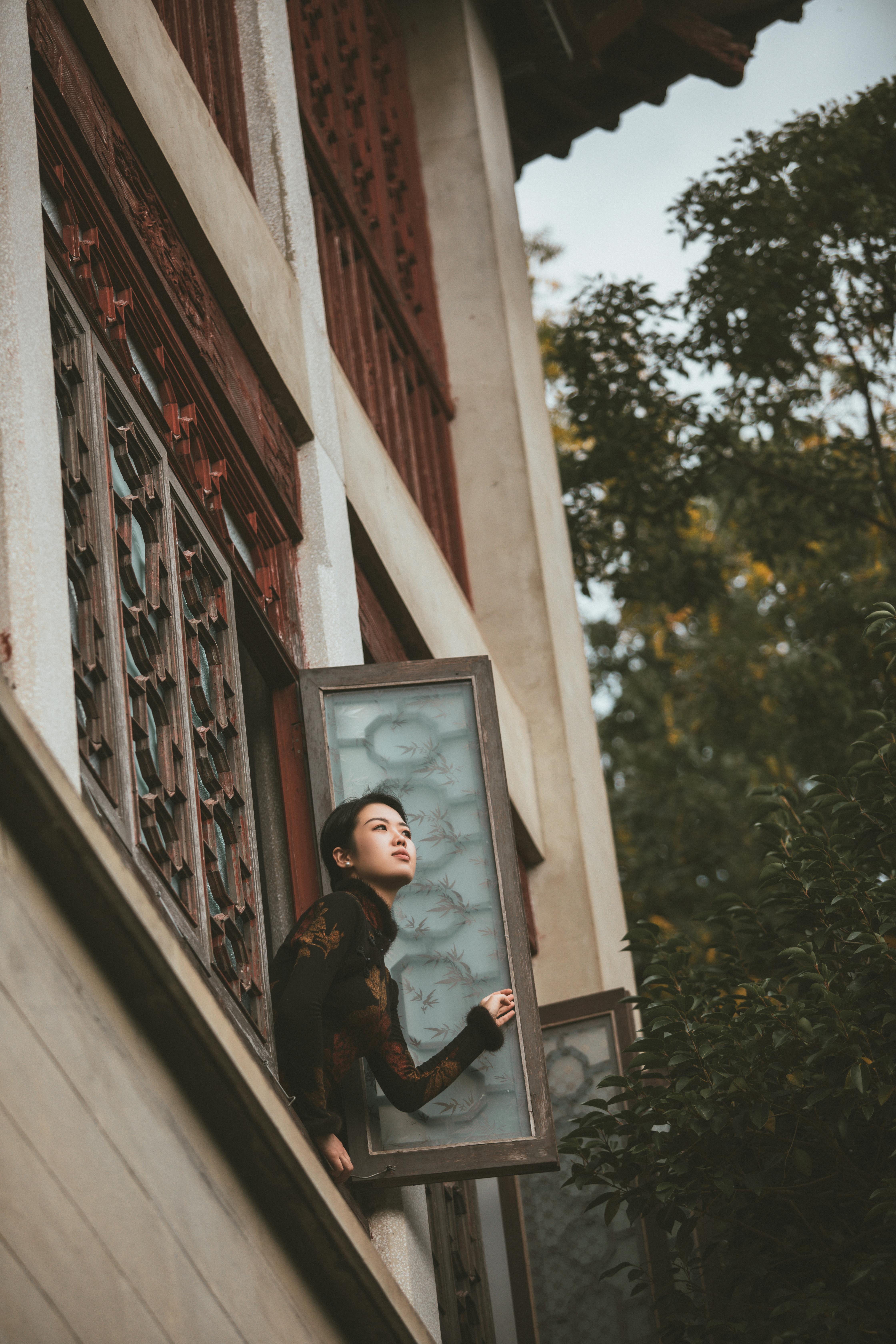 Beautiful Woman Looking out the Window · Free Stock Photo