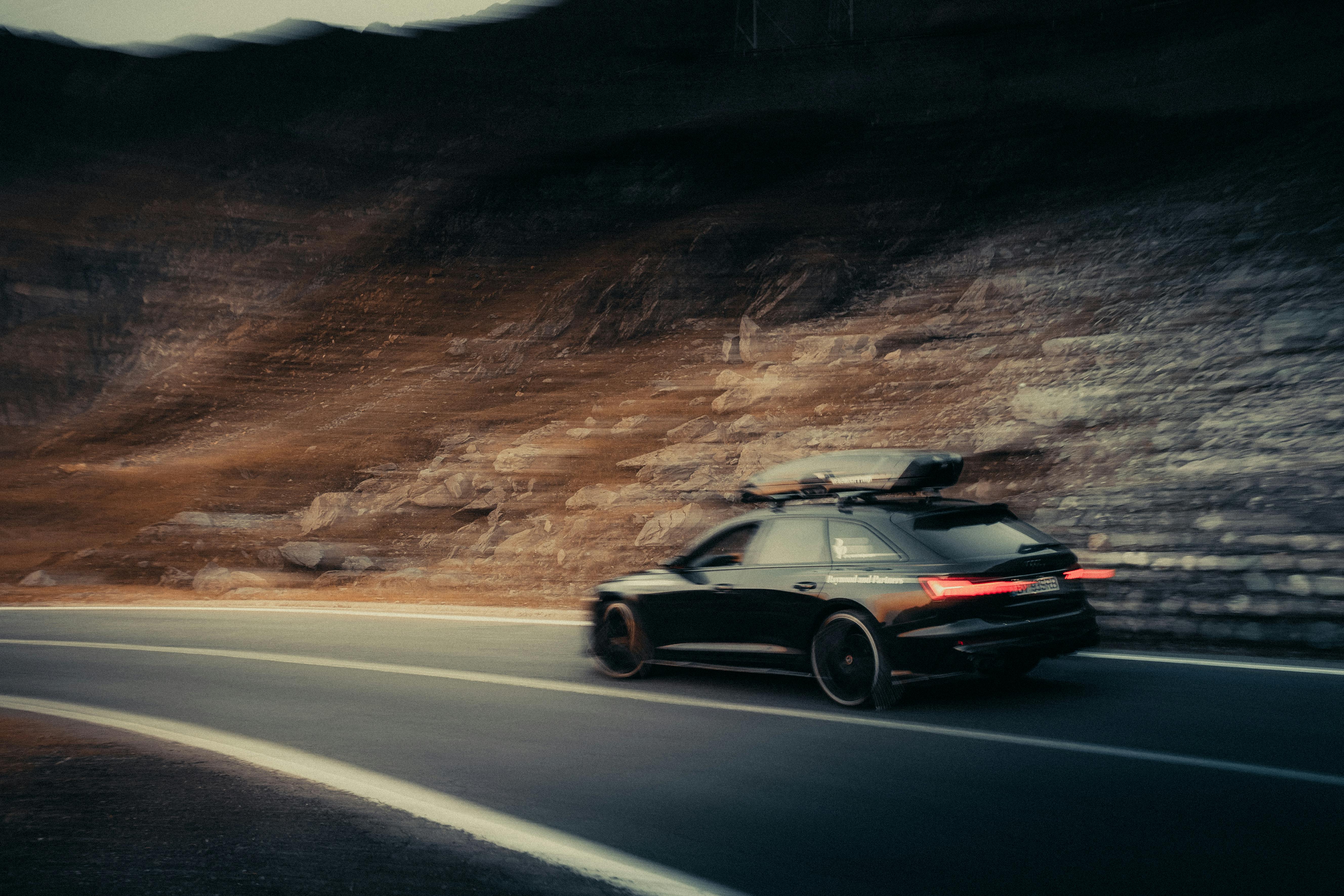 A Black Car on the Road · Free Stock Photo