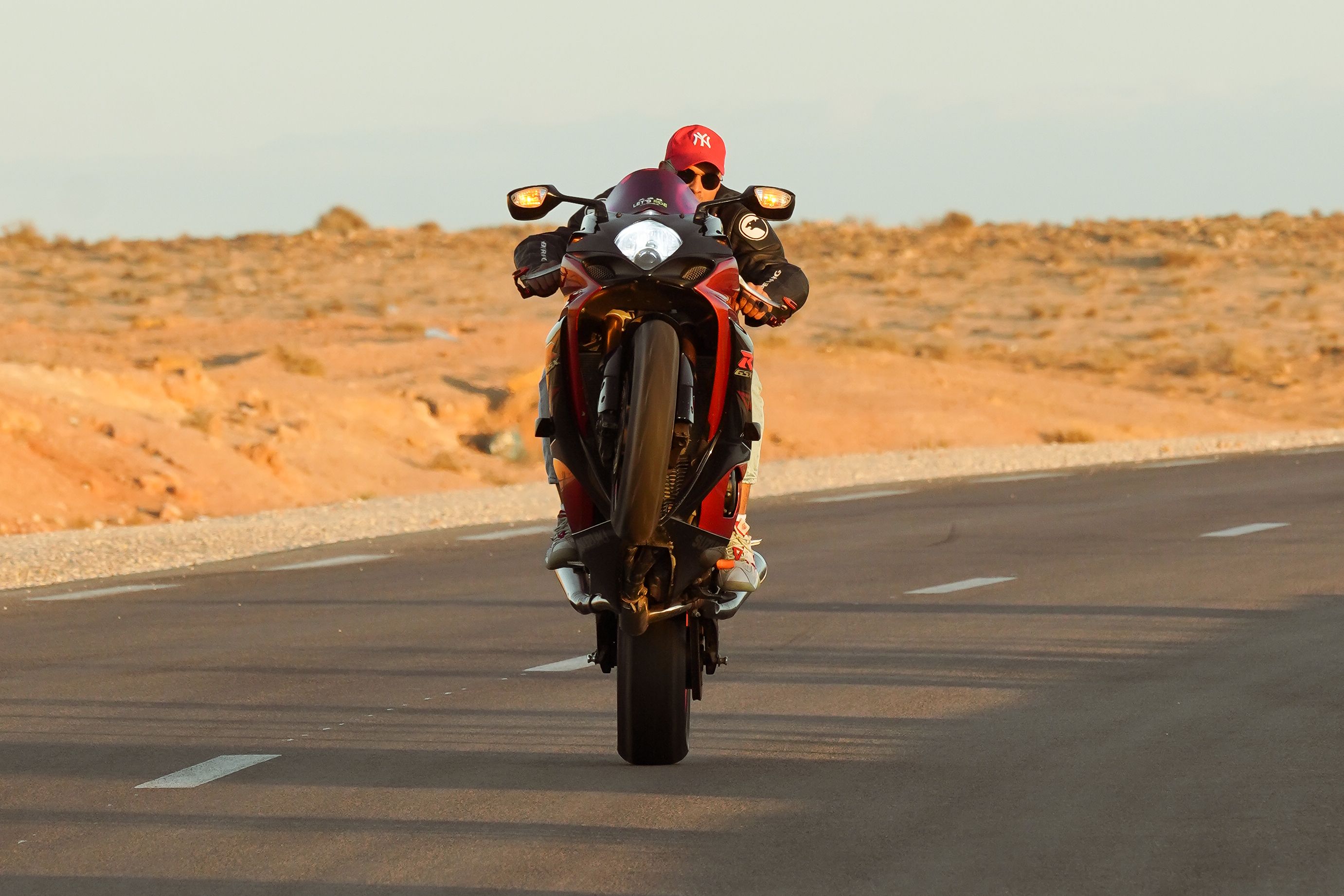 Biker Making a Wheelie on Motorcycle · Free Stock Photo