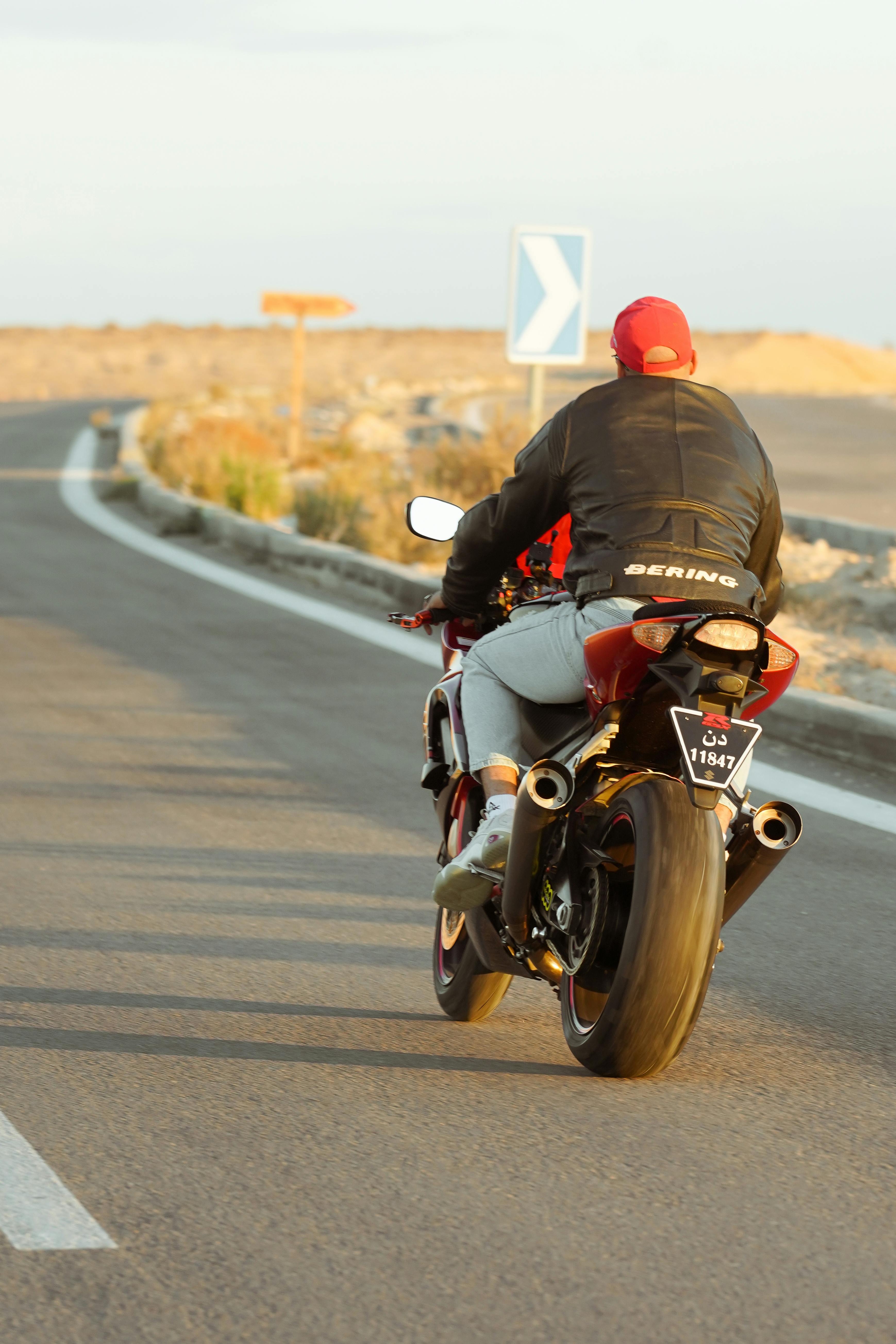 Back View o a Man Riding a Motorbike · Free Stock Photo