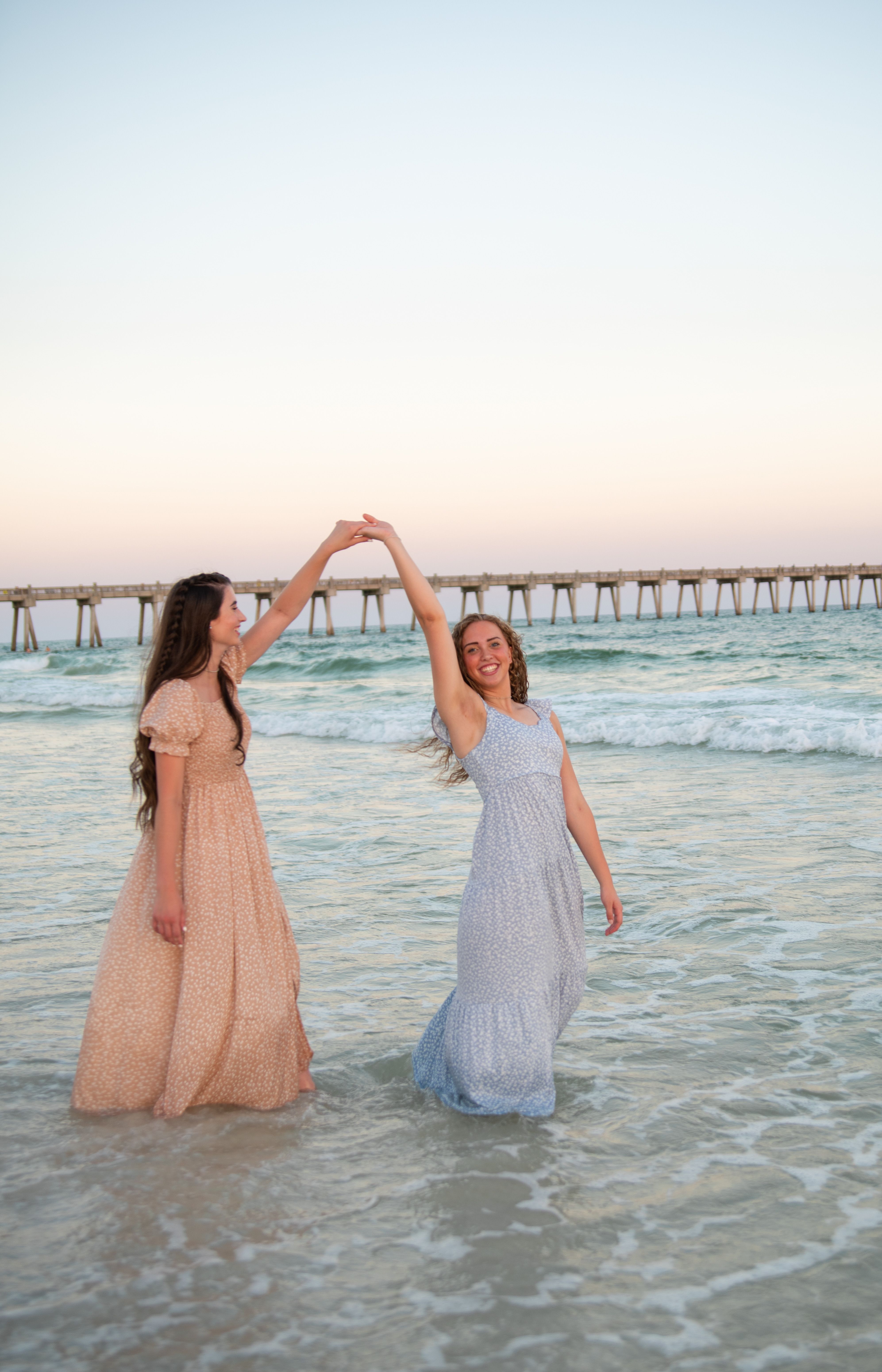Women Holding Hands at the Beach · Free Stock Photo