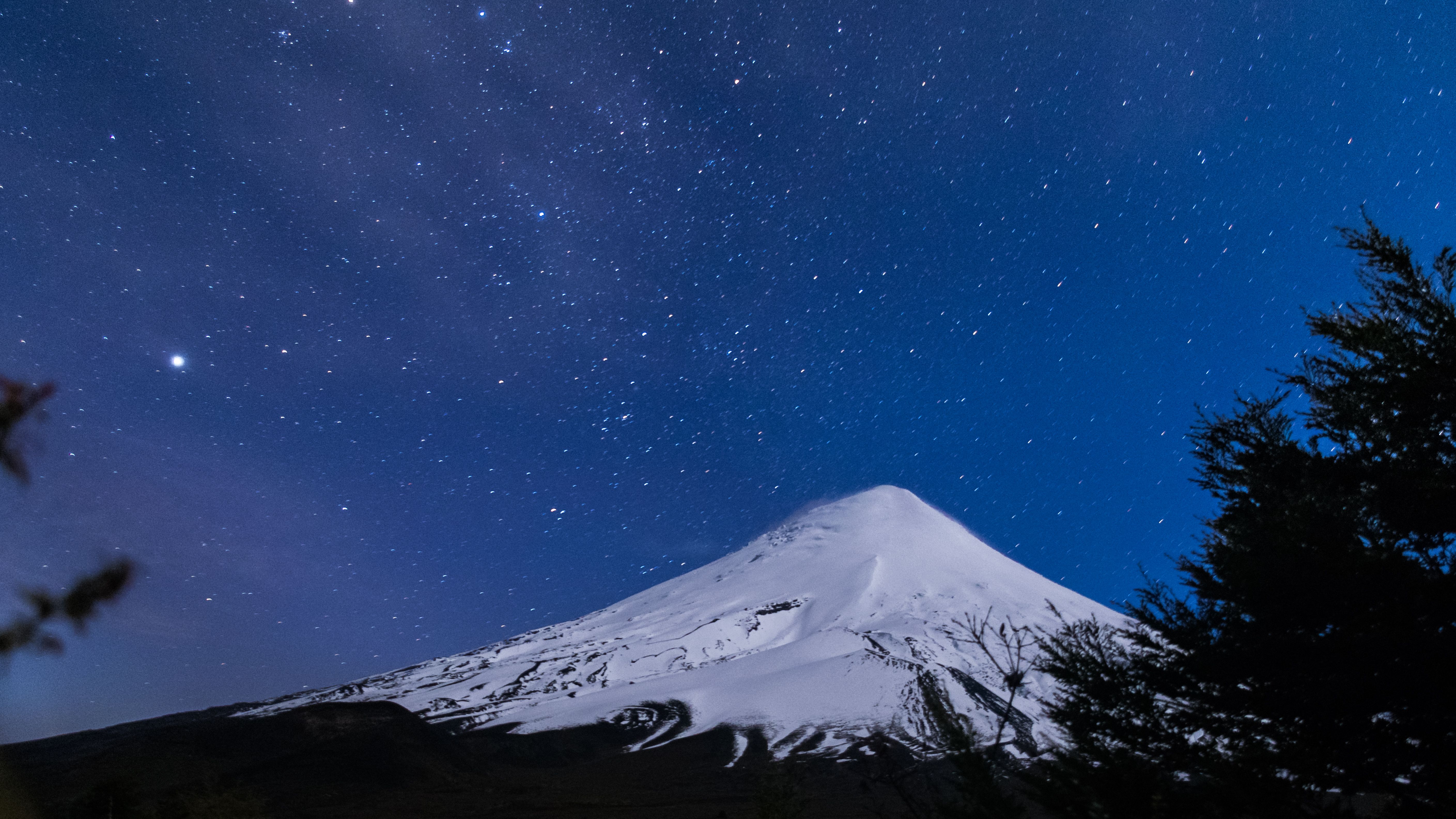 Snowed Mountain under Star Field · Free Stock Photo