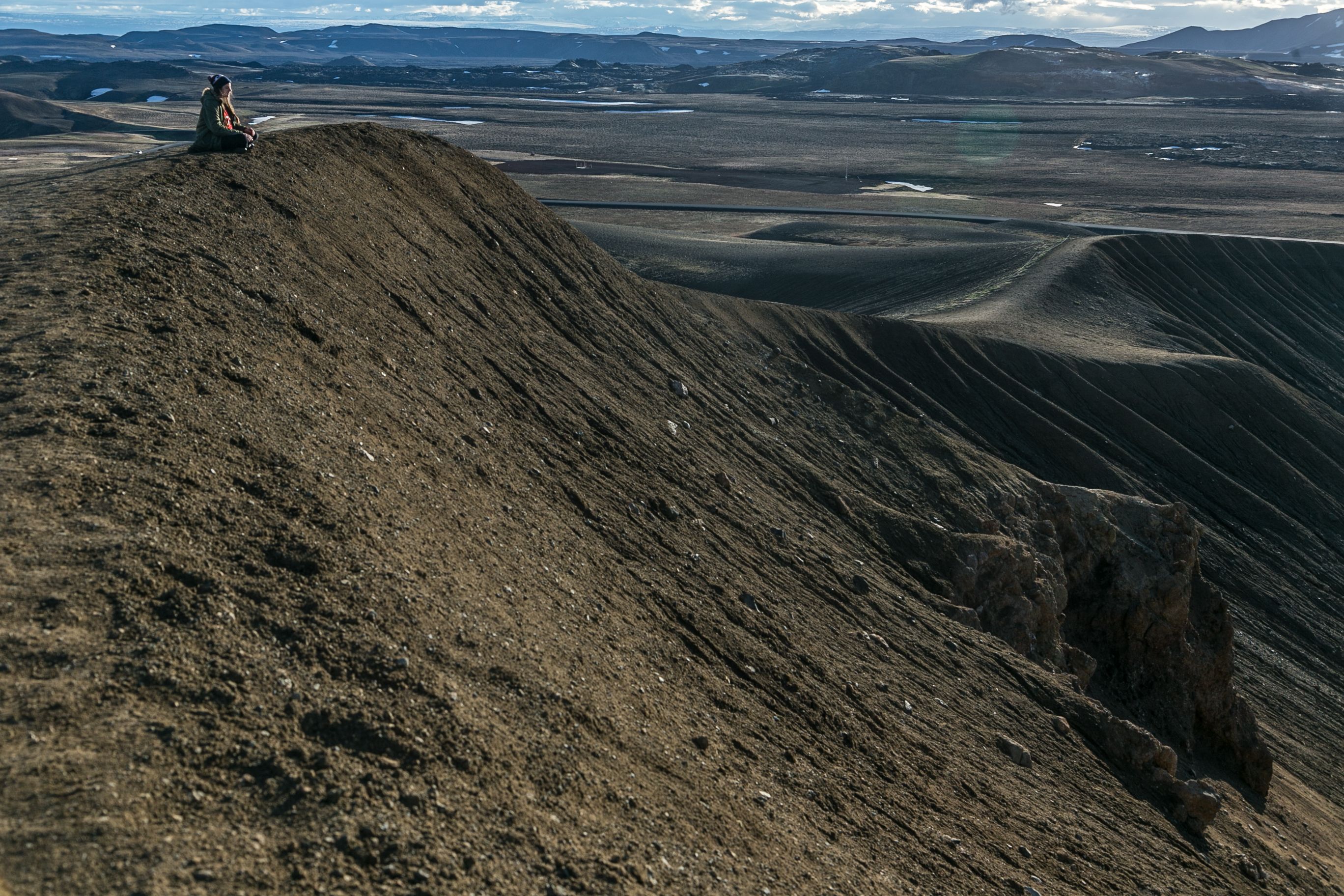 View of Person Sitting on a Cliff · Free Stock Photo