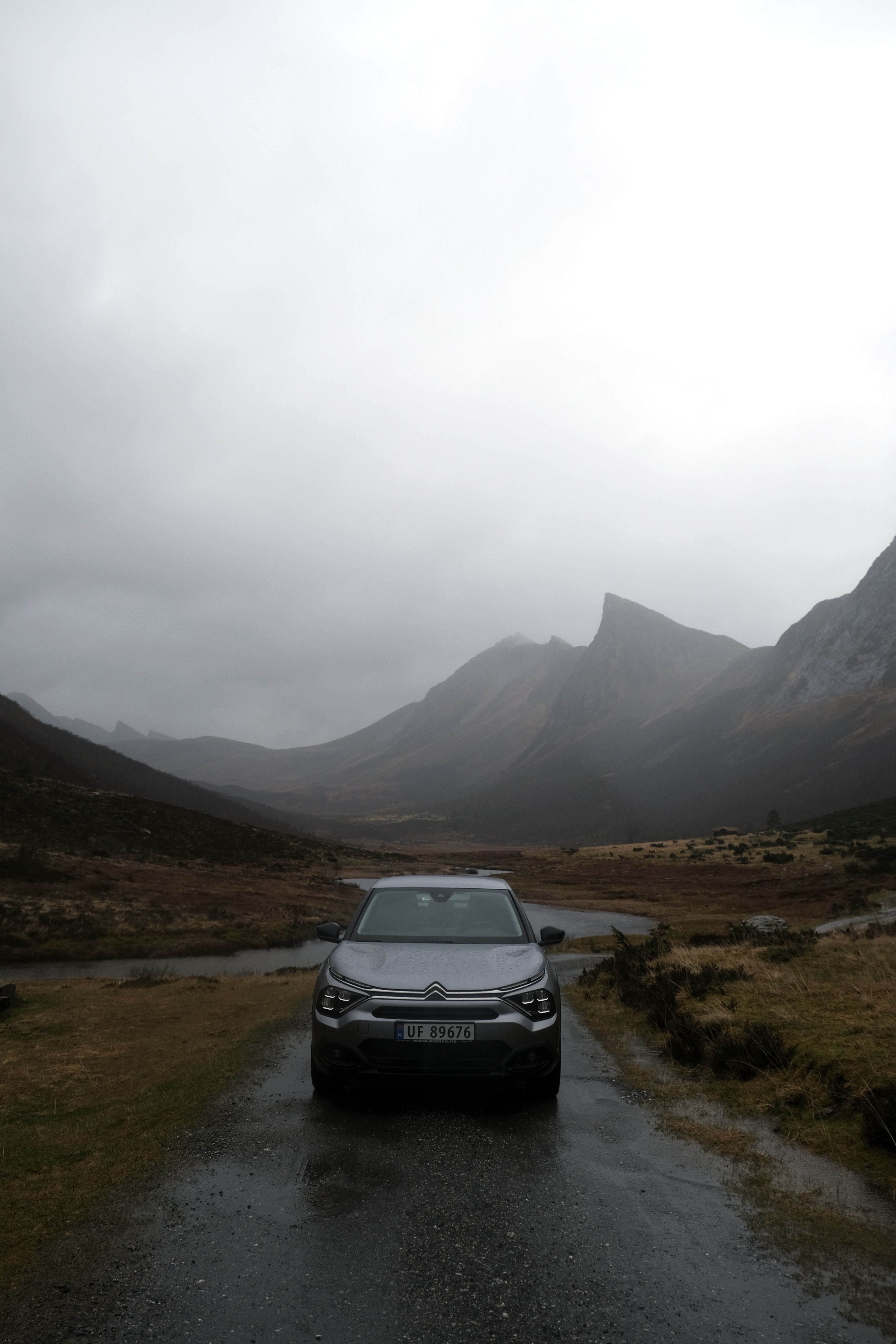 Car Parked on Road near the Mountains · Free Stock Photo