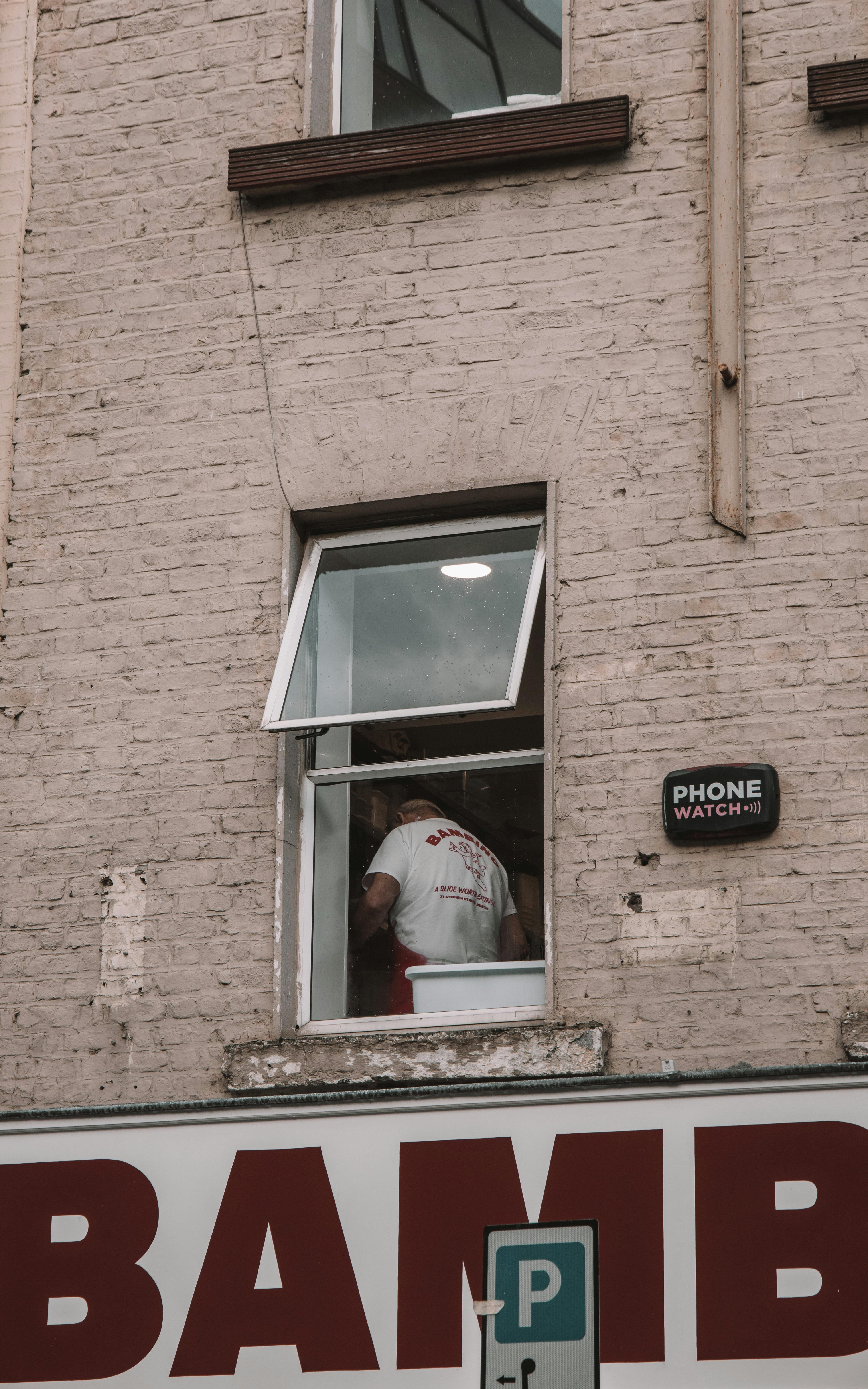 Man Standing in a Window · Free Stock Photo
