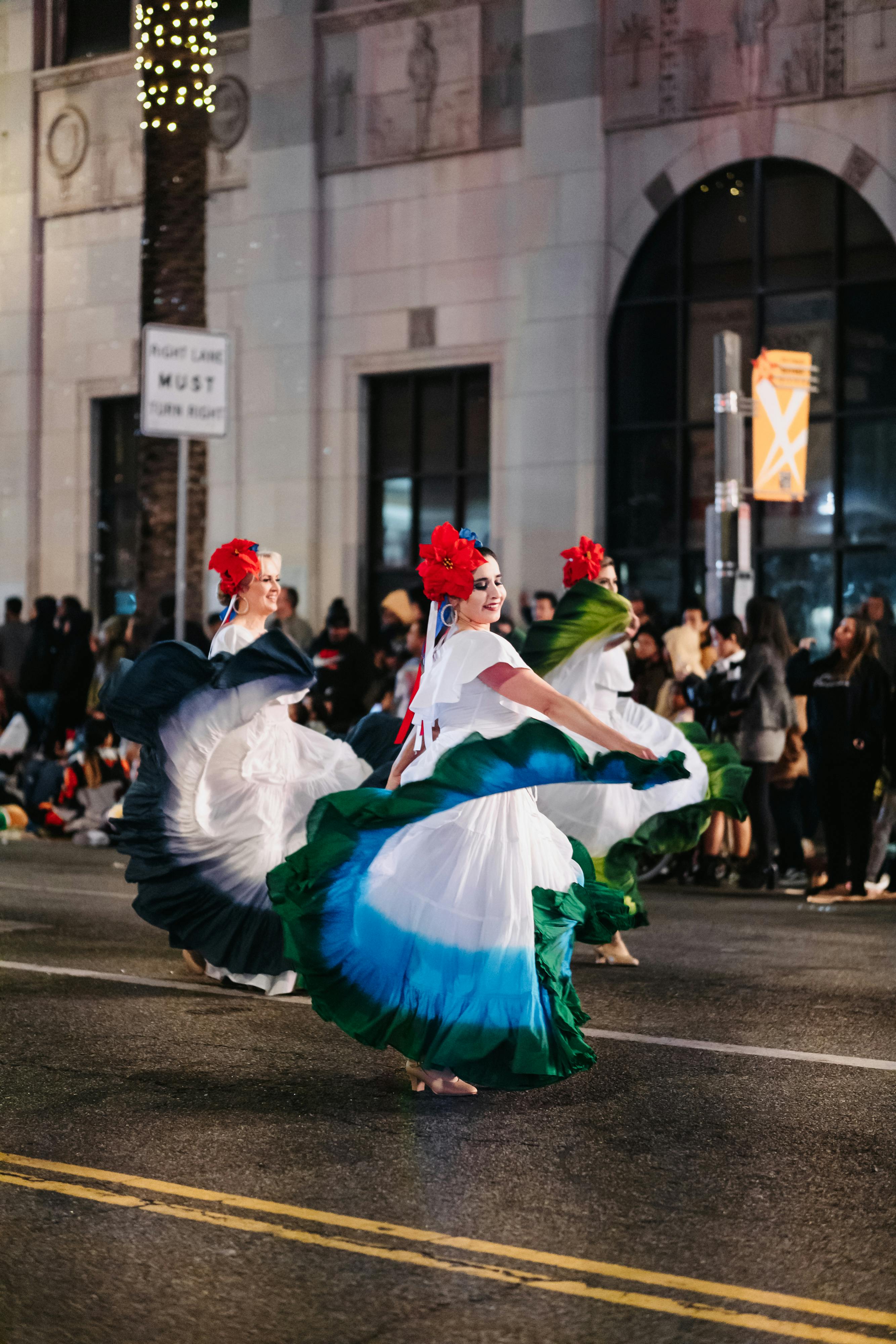 Three Women Dancing on a Street · Free Stock Photo