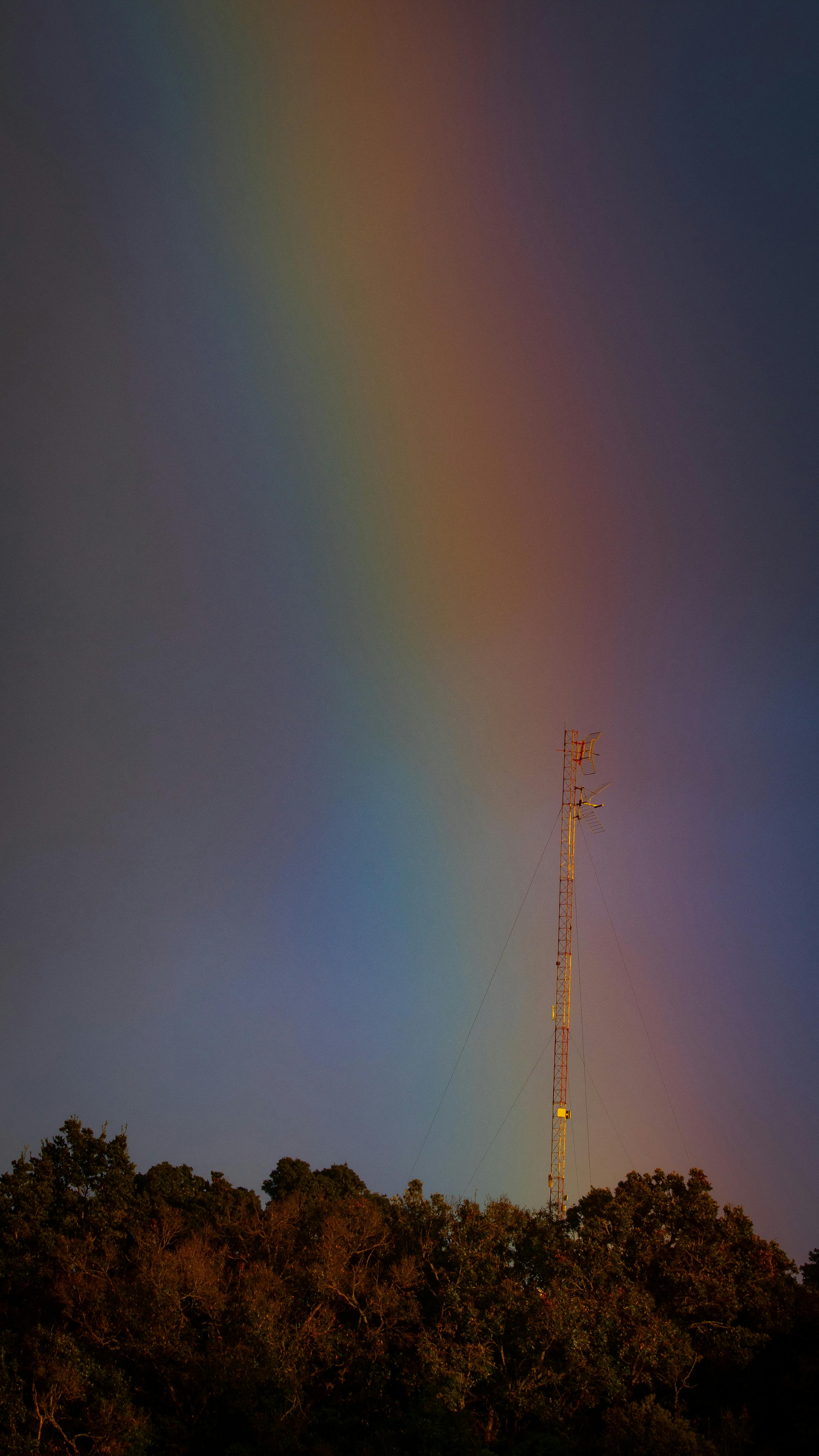 Photograph of a Rainbow Starting on a Hill · Free Stock Photo