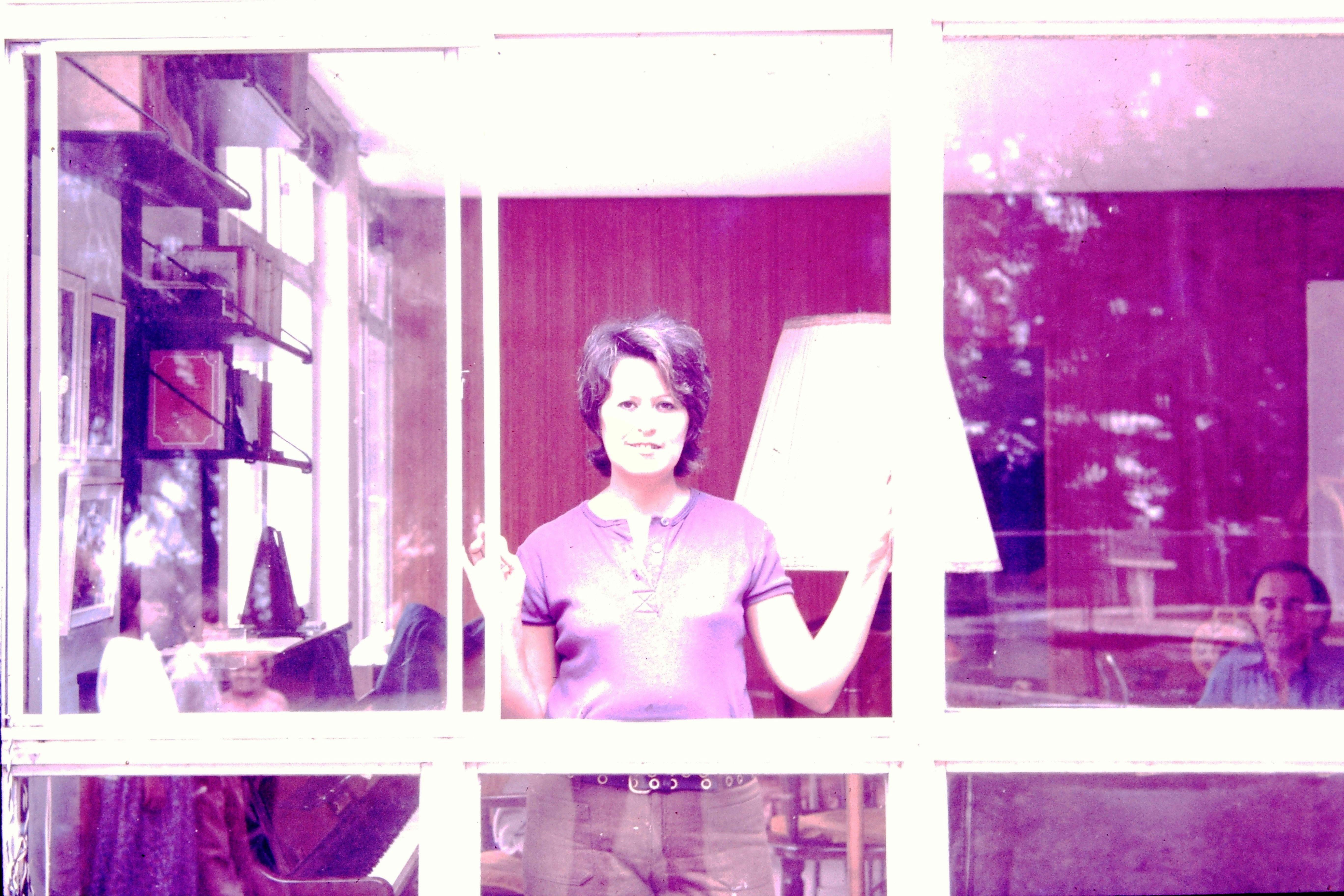 Man Standing behind Glass Window with Holes · Free Stock Photo