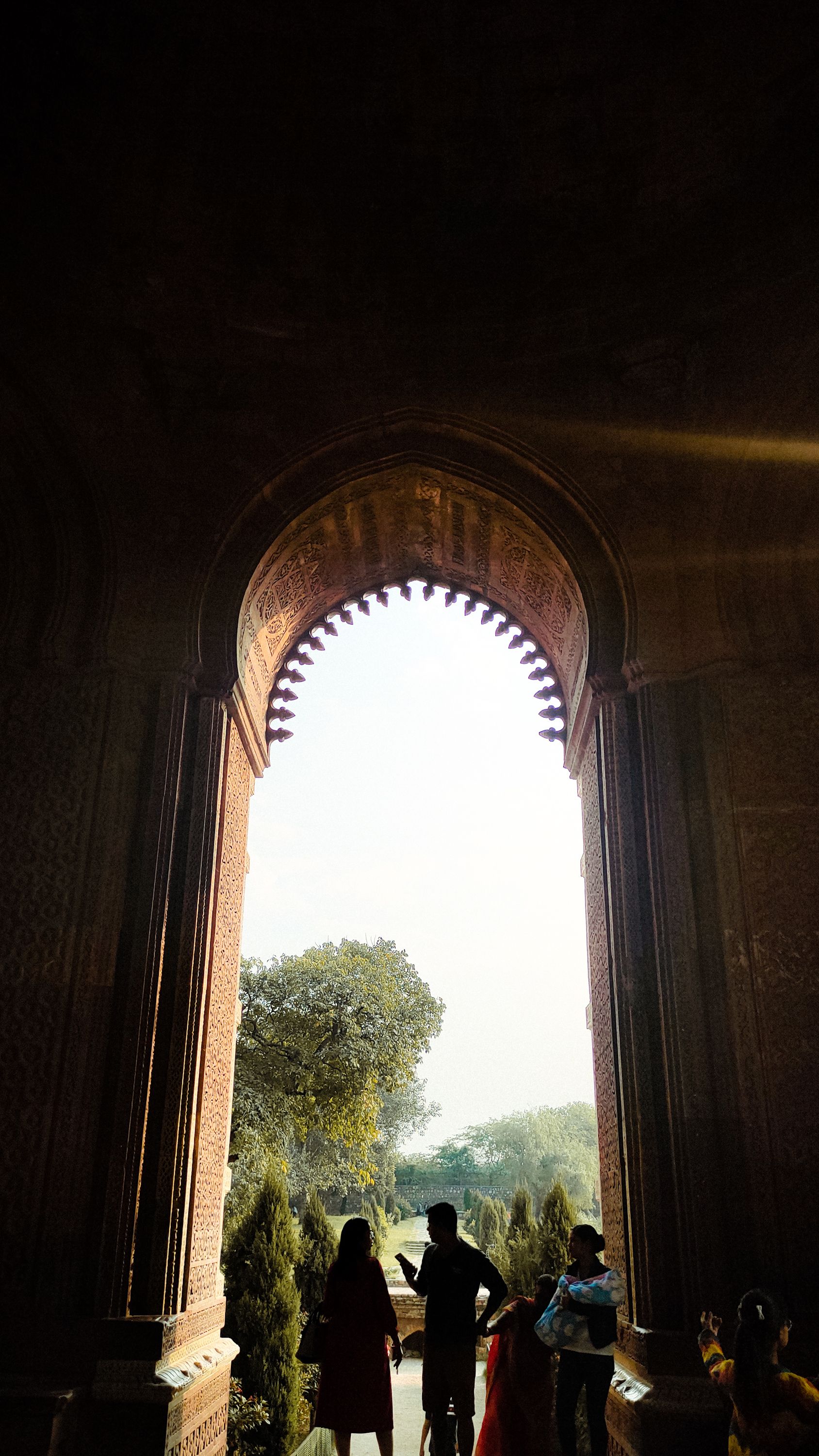 People Standing Under the Arch Building · Free Stock Photo