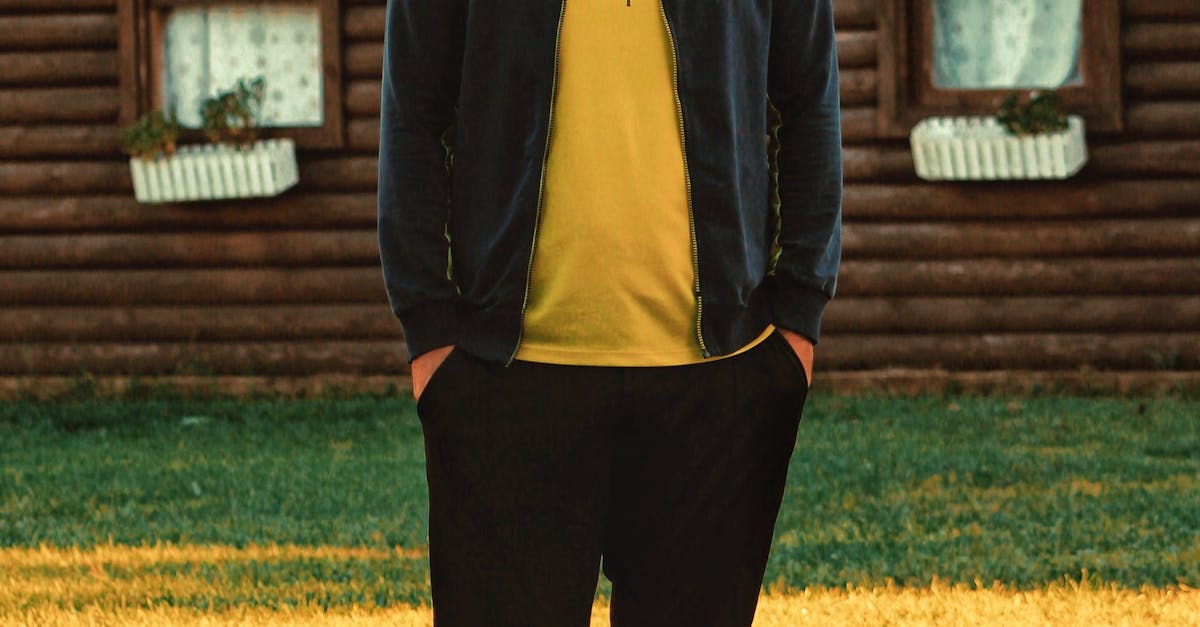 Man Wearing Blue Jacket Standing on Grass · Free Stock Photo Man Wearing Blue Jacket Standing on Grass · Free Stock Photo