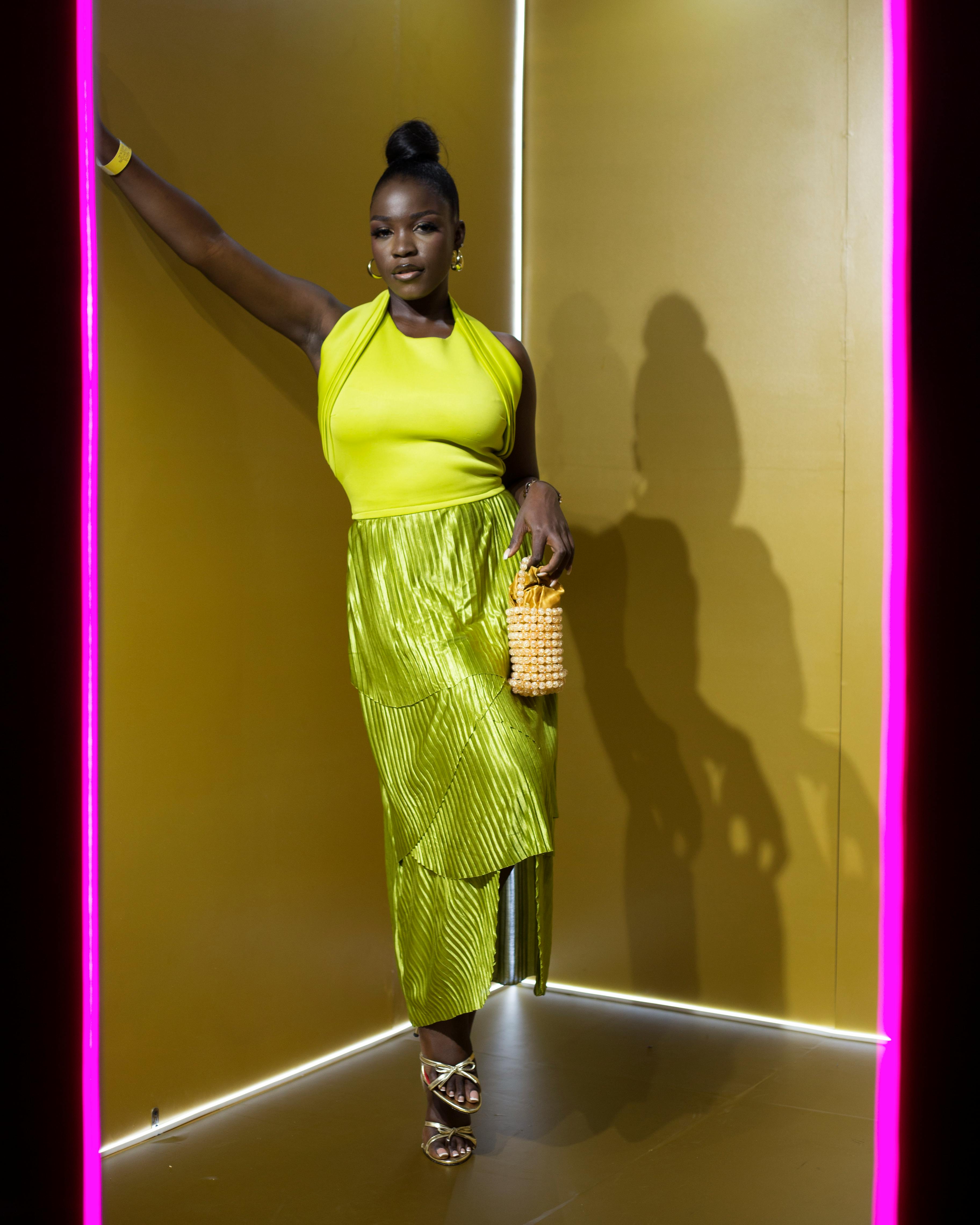 Model Posing in a Fashionable Green Outfit · Free Stock Photo