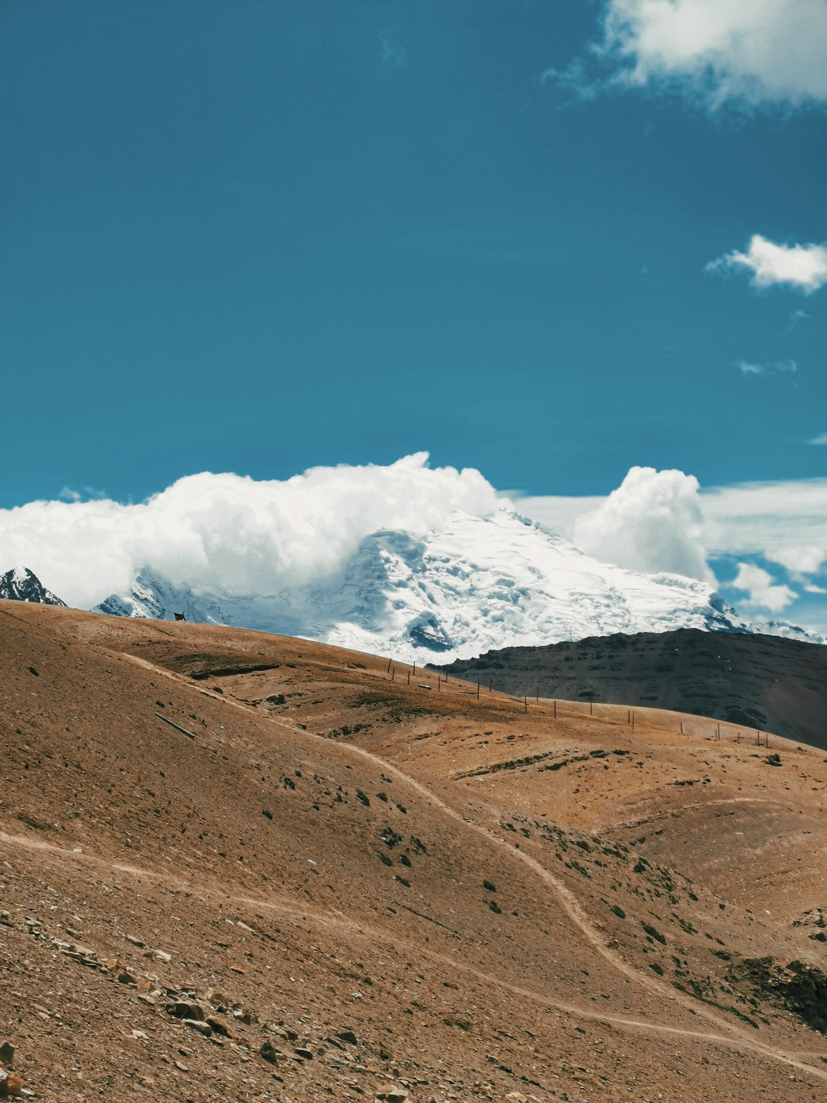 Arid Hill on Blue Sky Background · Free Stock Photo