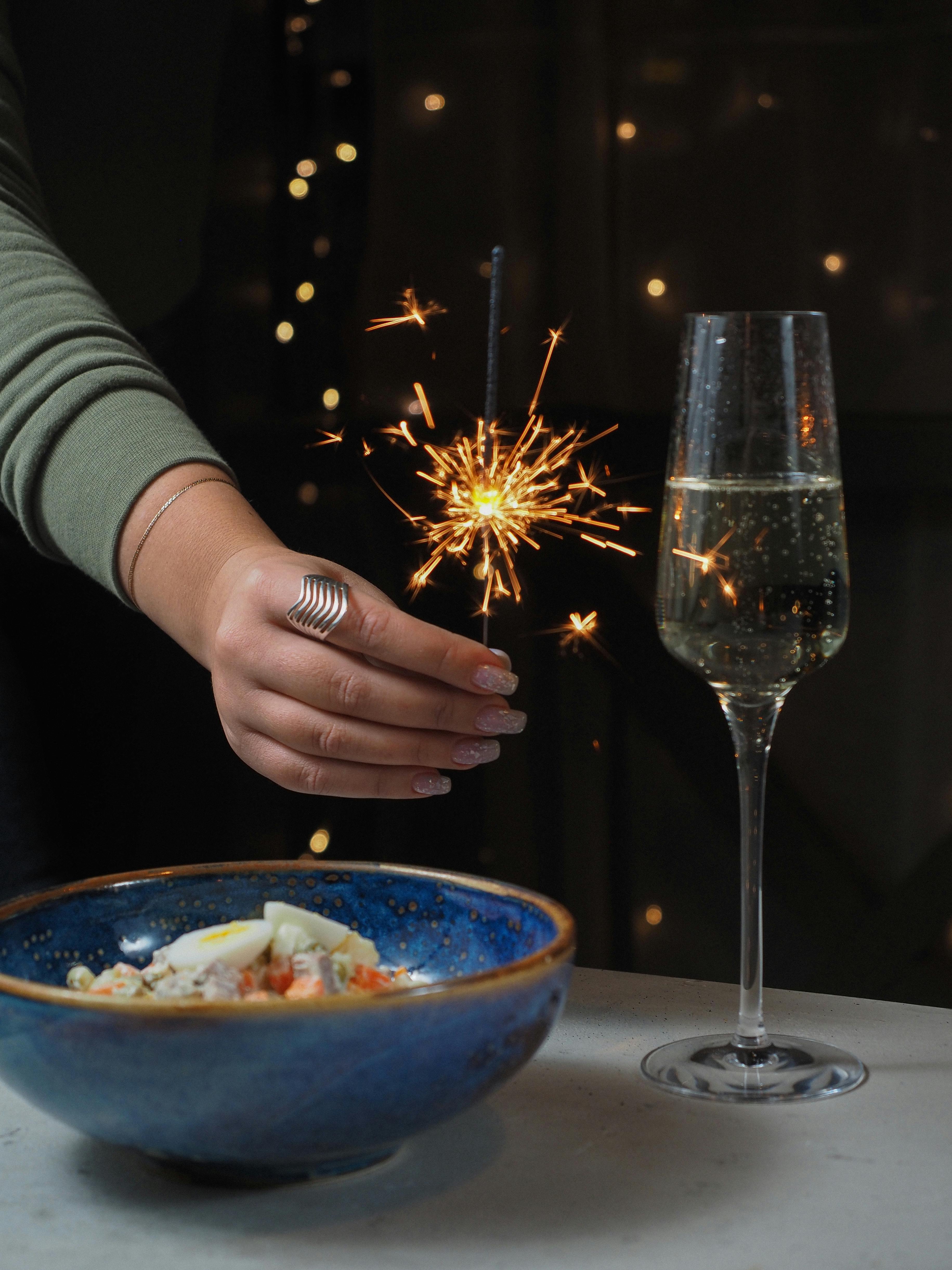 Hand Holding Sparkler in Winter · Free Stock Photo
